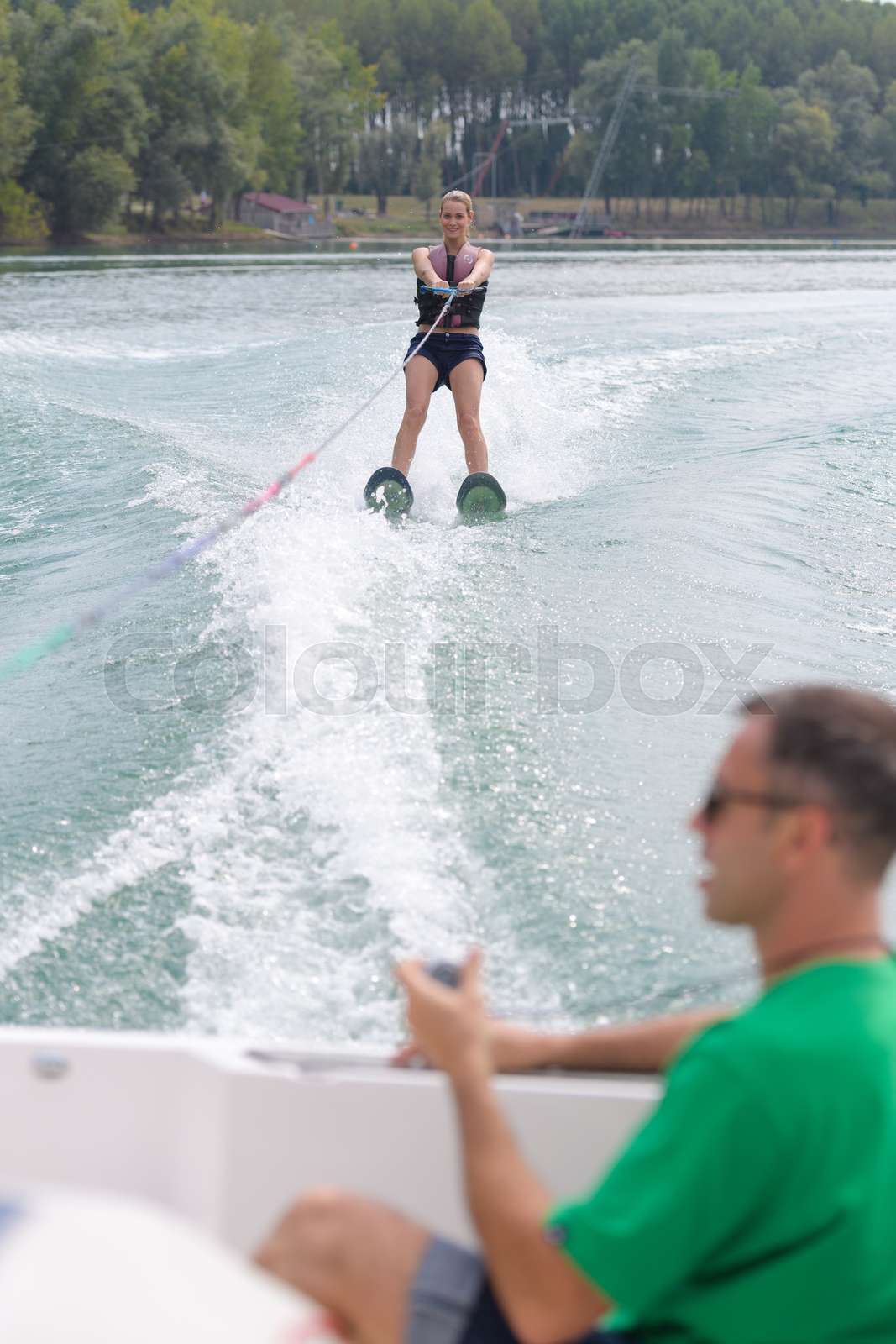 woman water skiing behind boat | Stock image | Colourbox