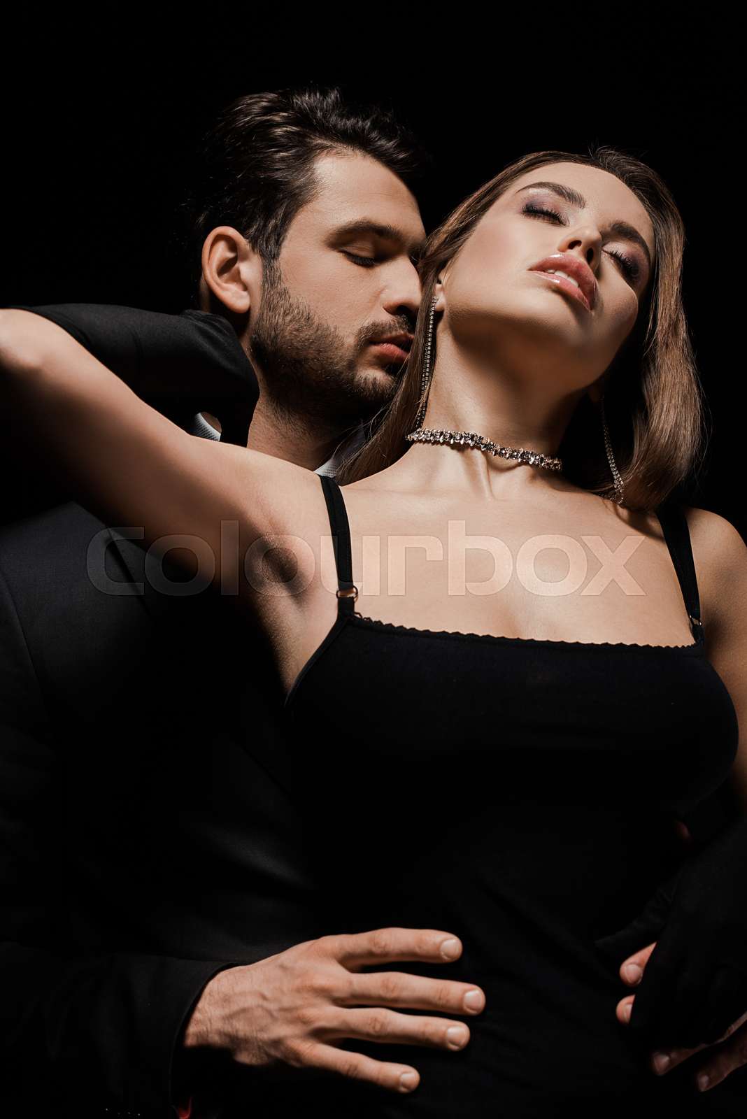 Man Kissing Girls Neck