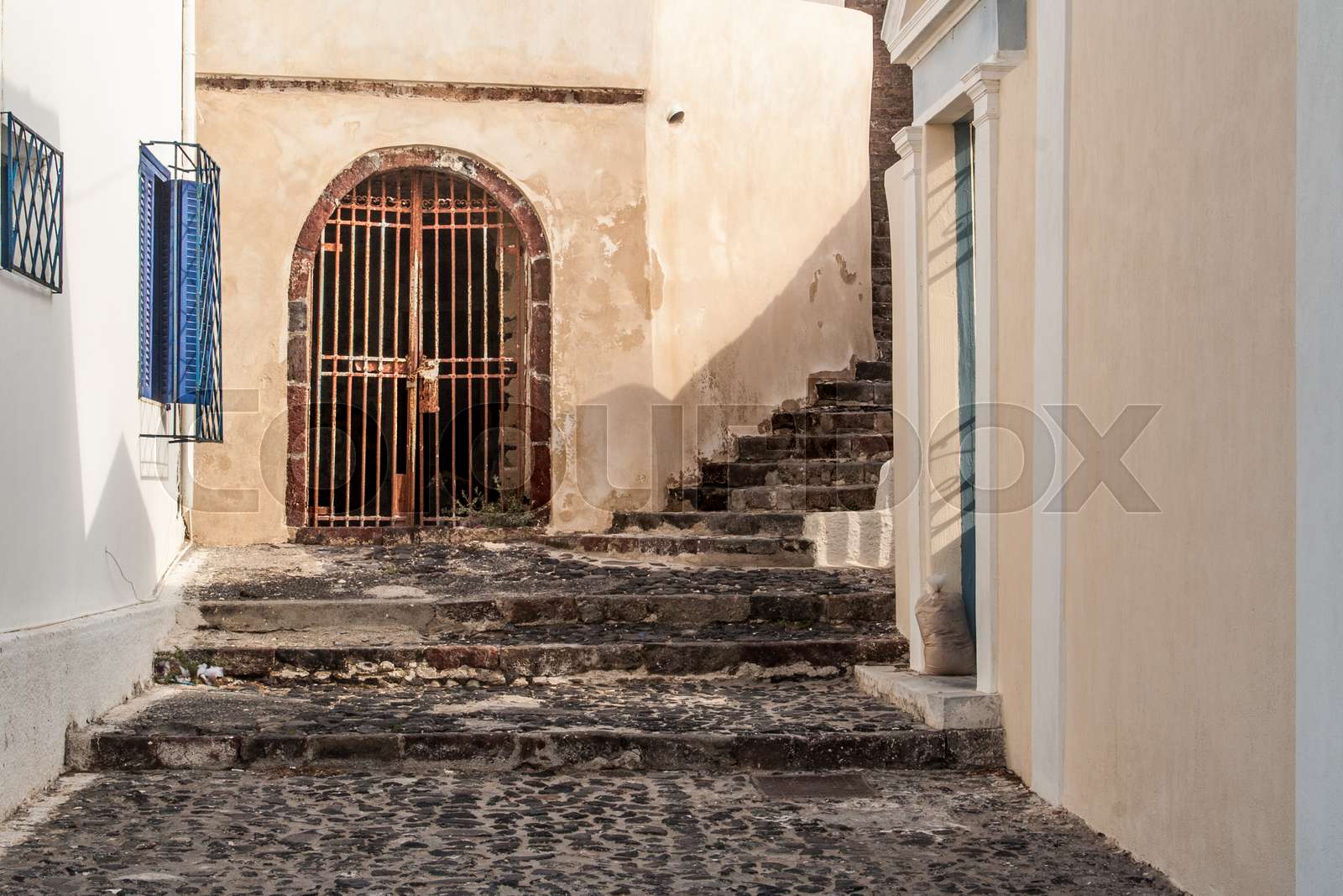 Ancient Cobblestone Walkway and Steps Among Building in Santorini ...