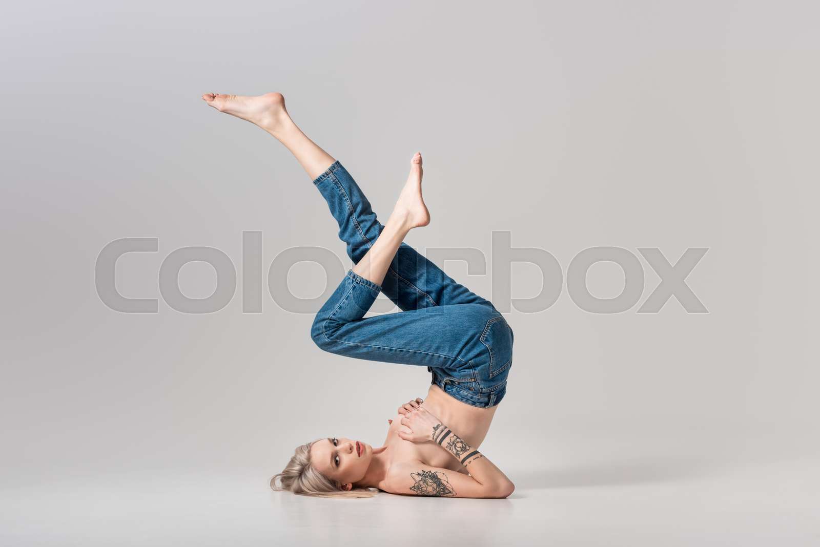 Young Topless Tattooed Girl In Jeans Posing On Floor With Raised Legs 3375