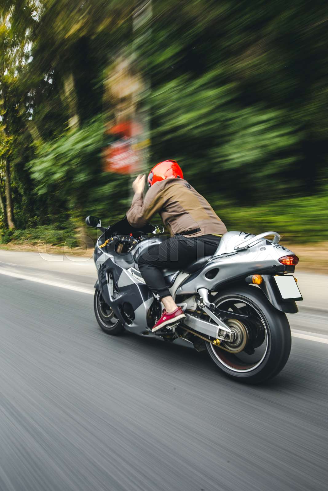 High speed motorcycle biking on the road | Stock image | Colourbox