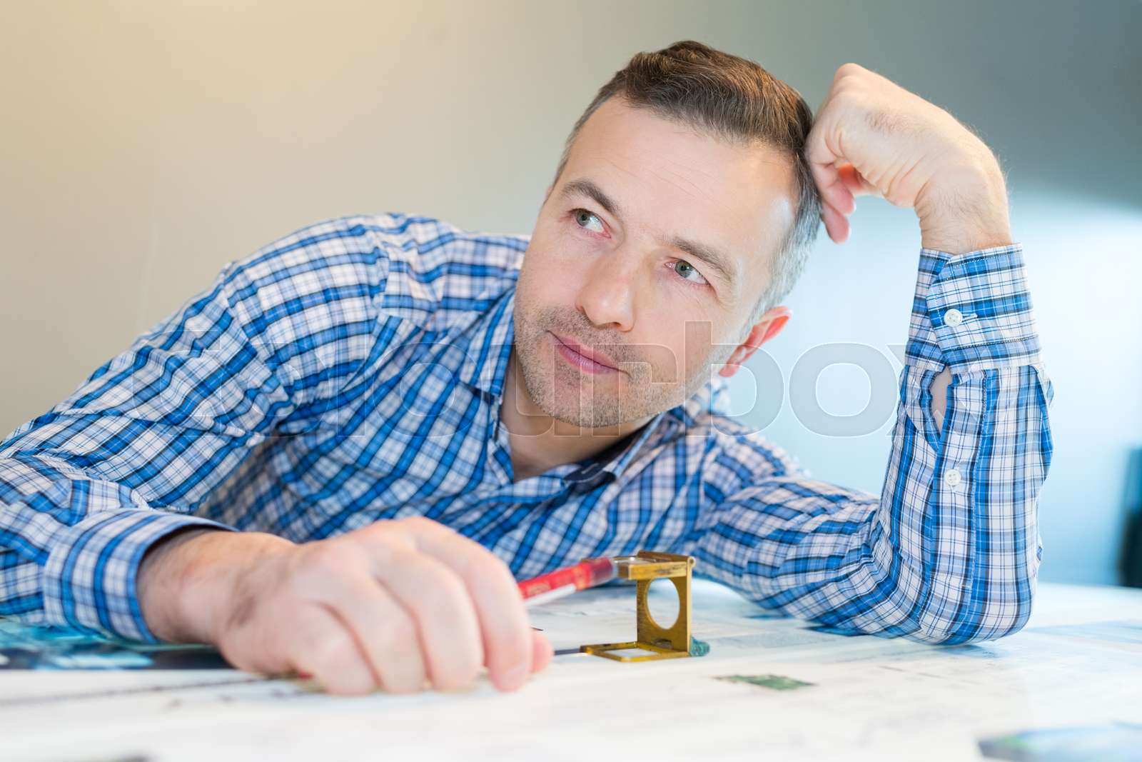 using magnifying glass to check the print quality | Stock image | Colourbox