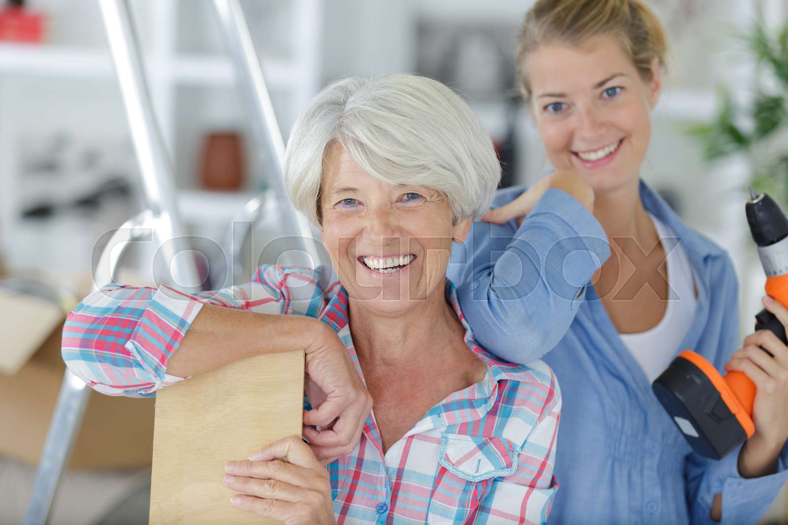daughter and mother doing diy | Stock image | Colourbox