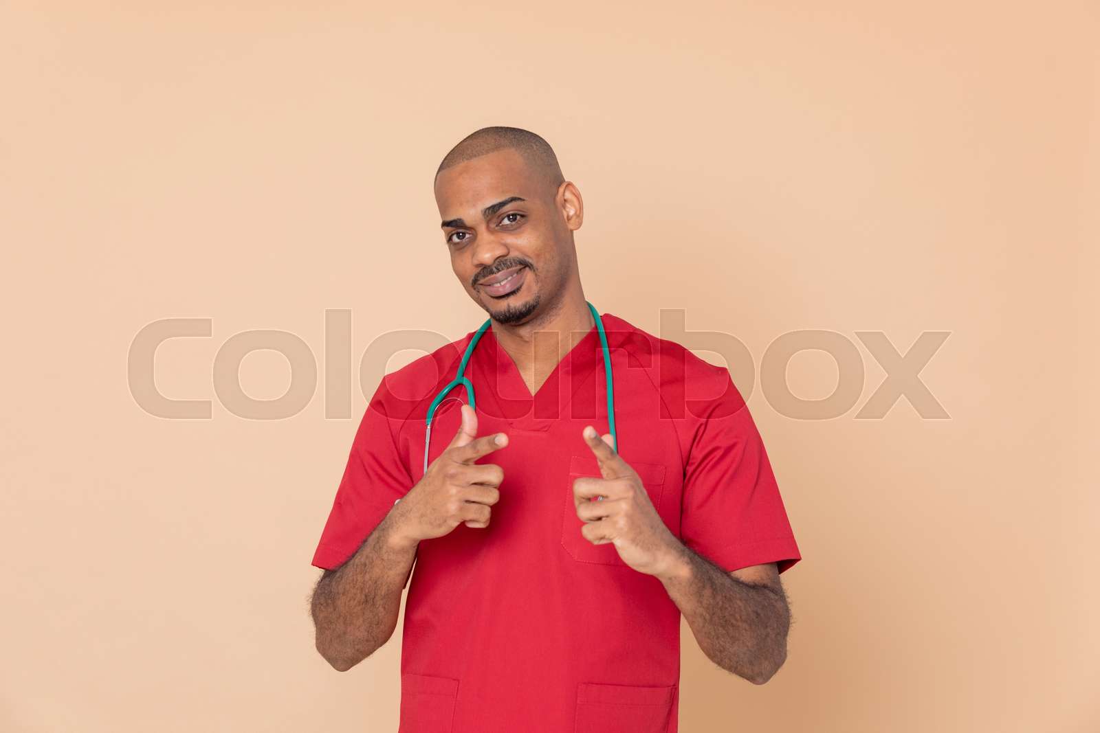 African doctor wearing a red uniform | Stock image | Colourbox