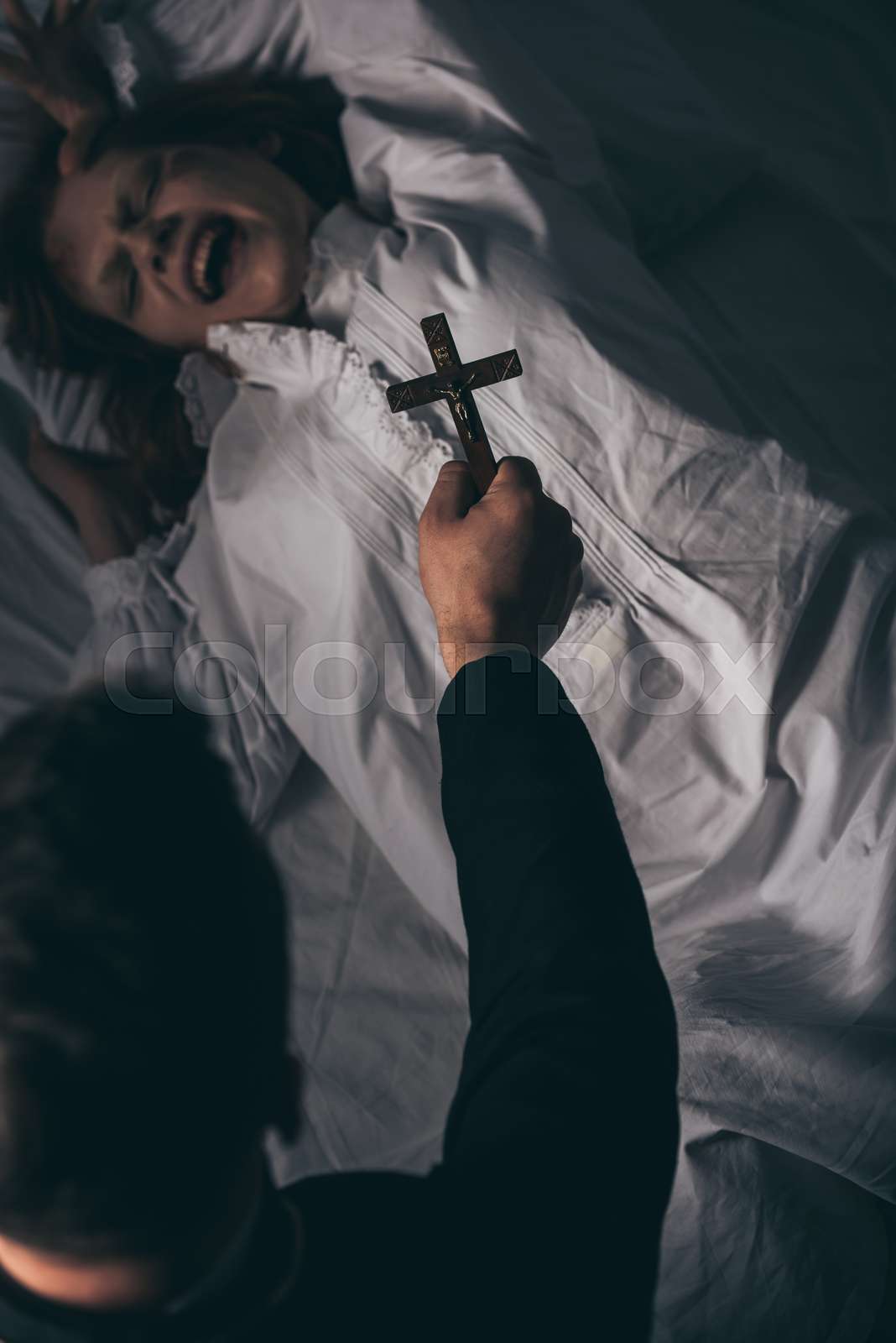 The Exorcist Stabbing Herself With A Cross
