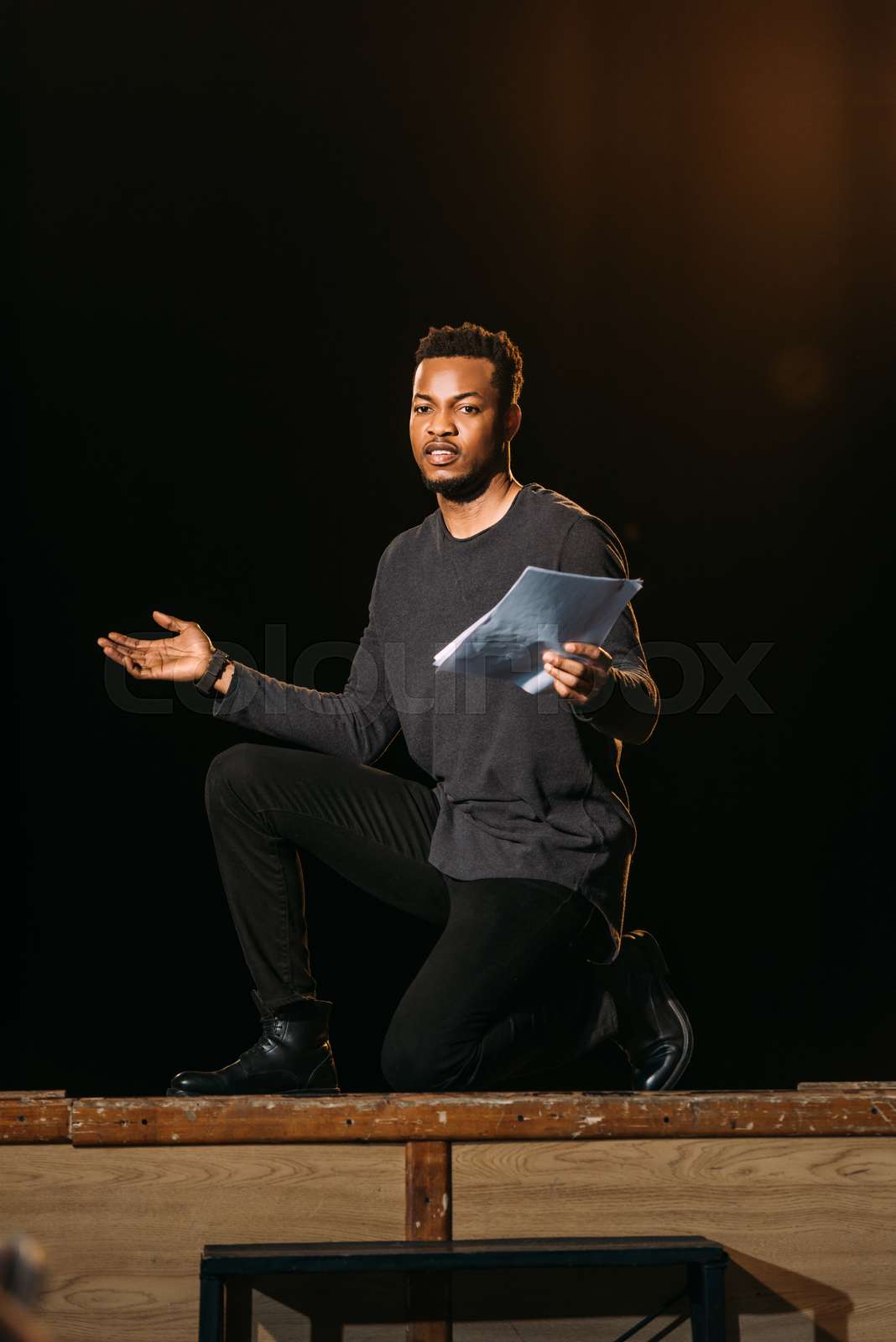 african american actor holding scenario on stage during rehearse ...