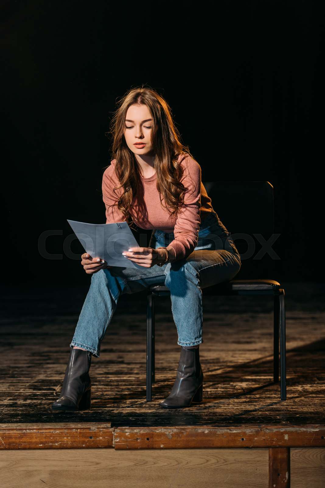 beautiful young actress reading screenplay on stage in theatre | Stock ...