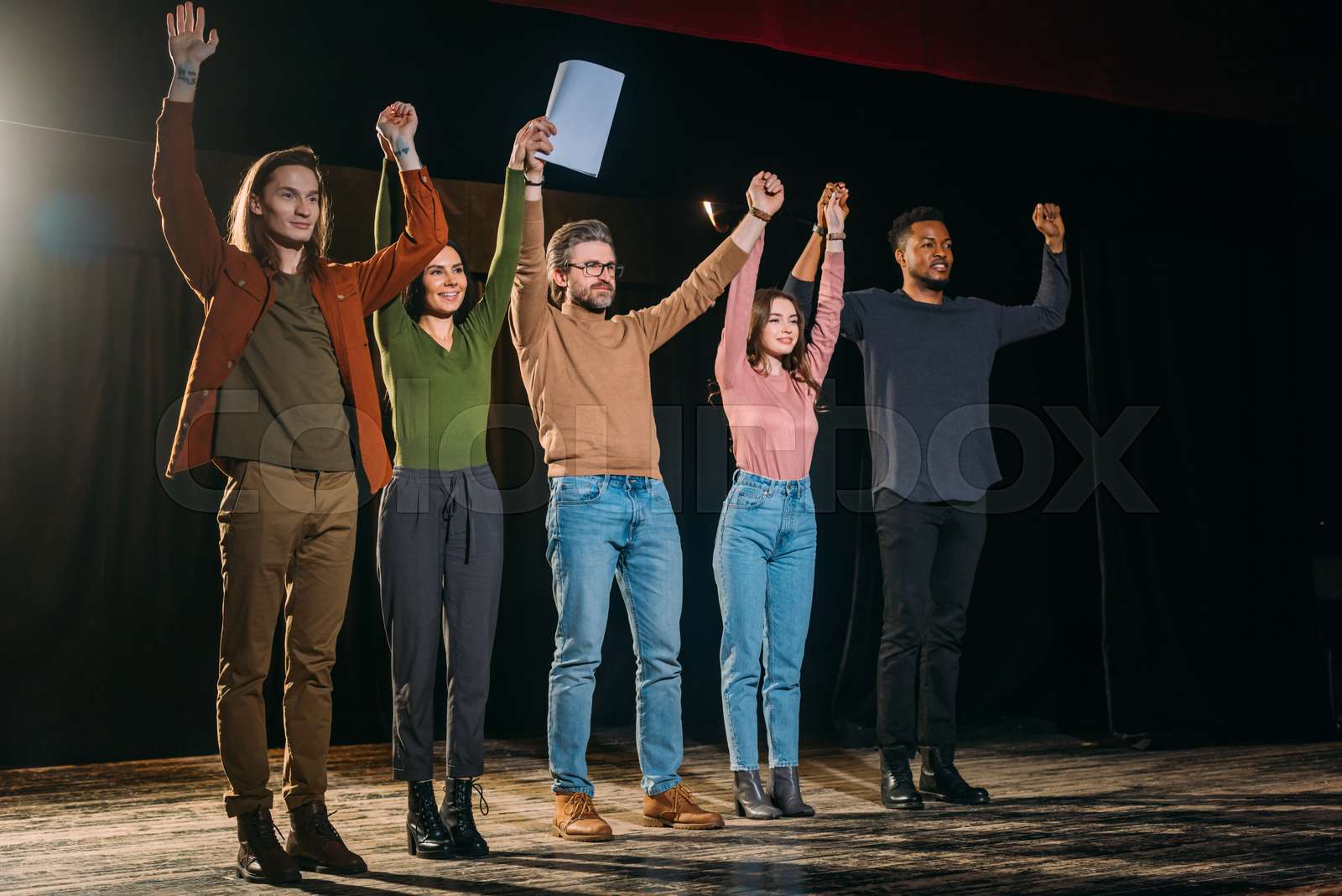 happy actors and actresses bowing on stage | Stock image | Colourbox