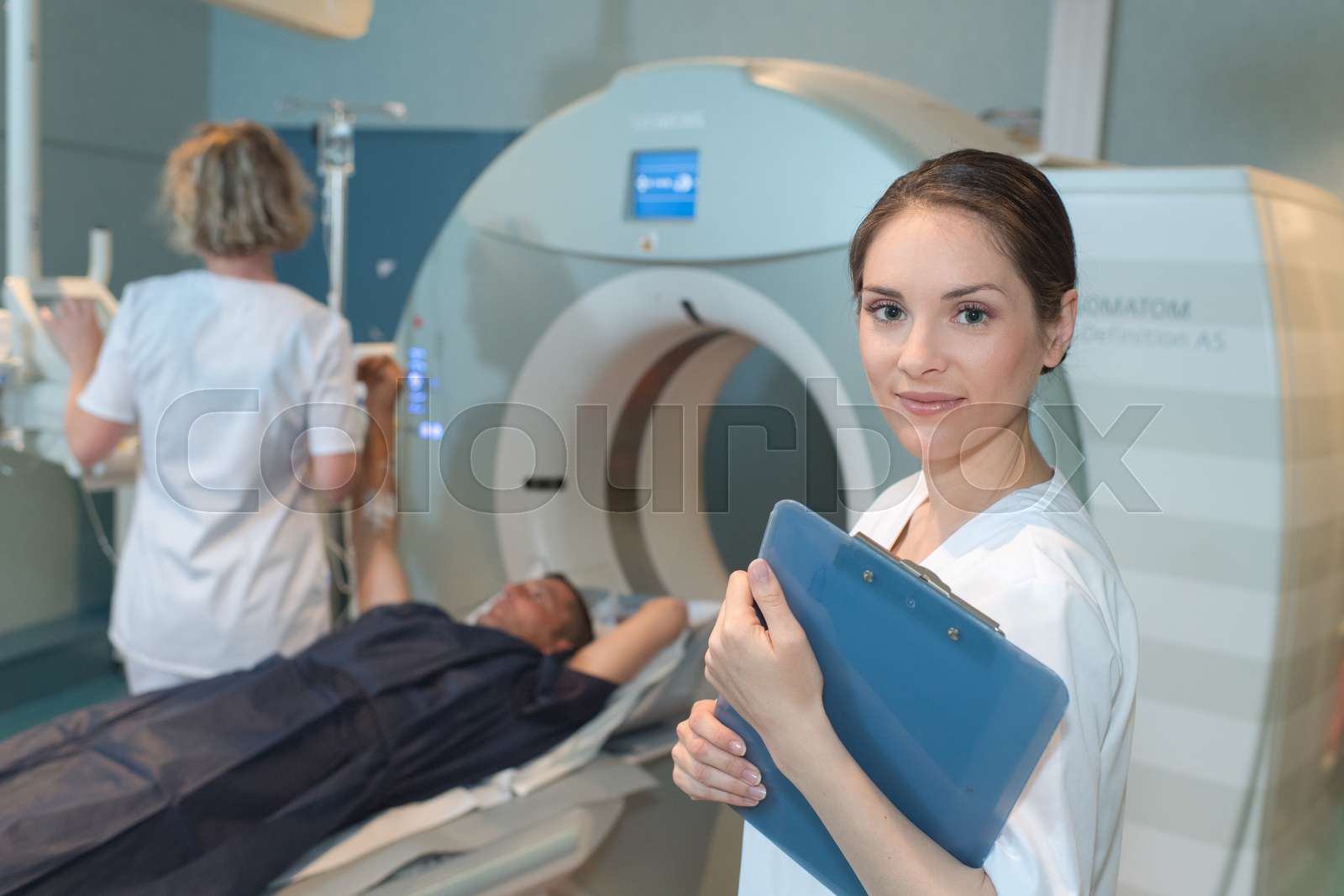 female patient undergoing ct scan test in examination room | Stock ...