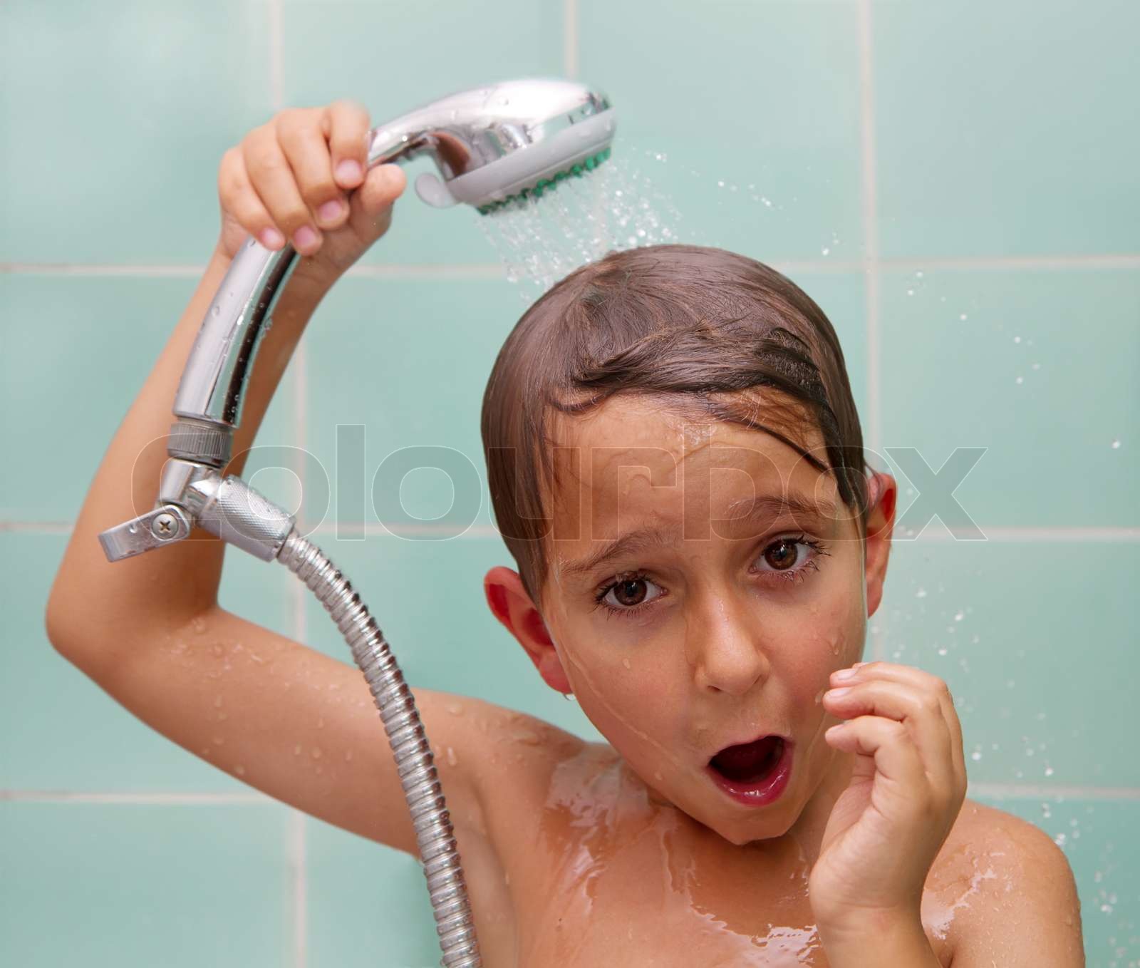 Little boy is bathed in the shower | Stock image | Colourbox