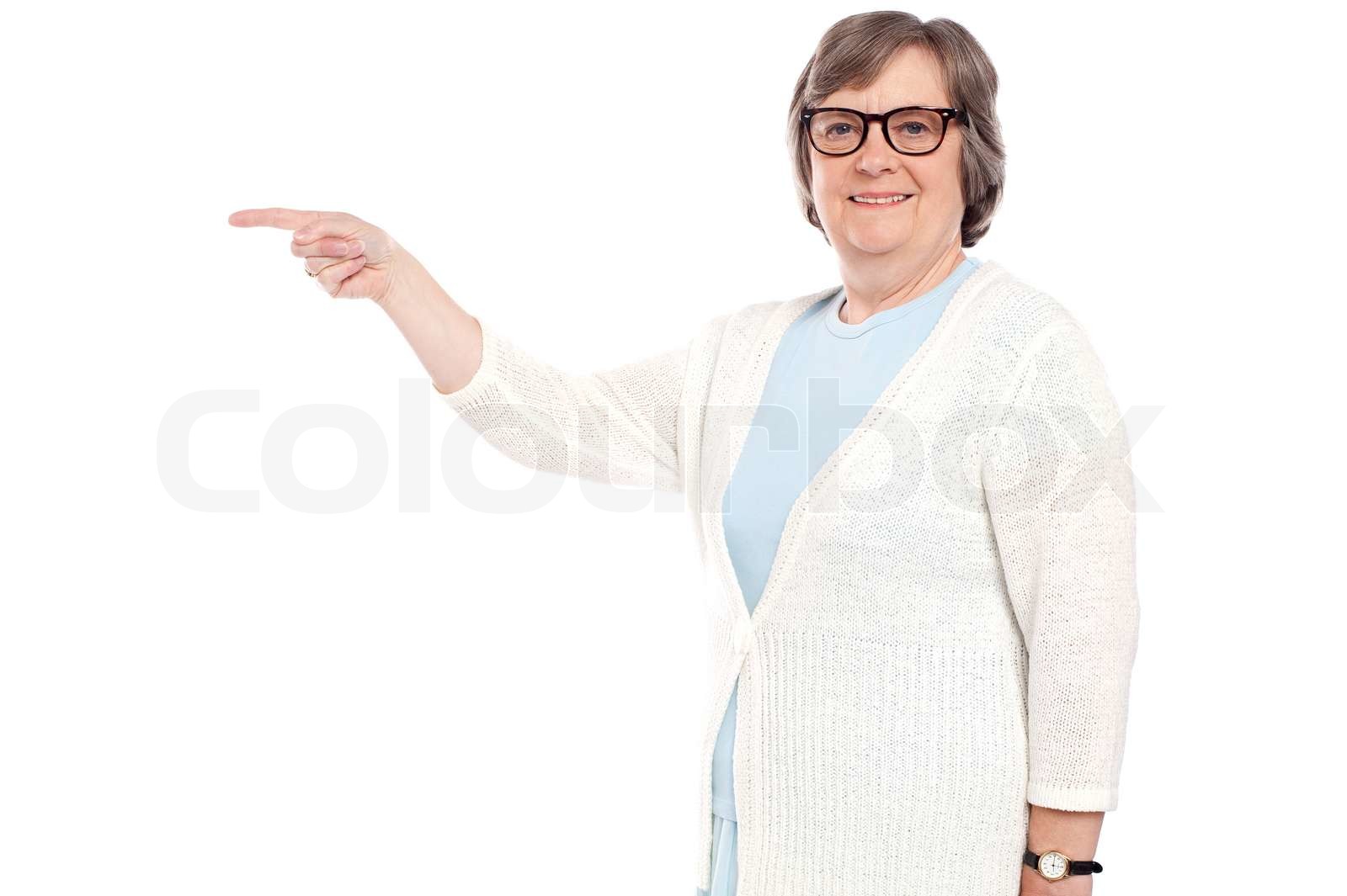 Beautiful old lady pointing away | Stock image | Colourbox