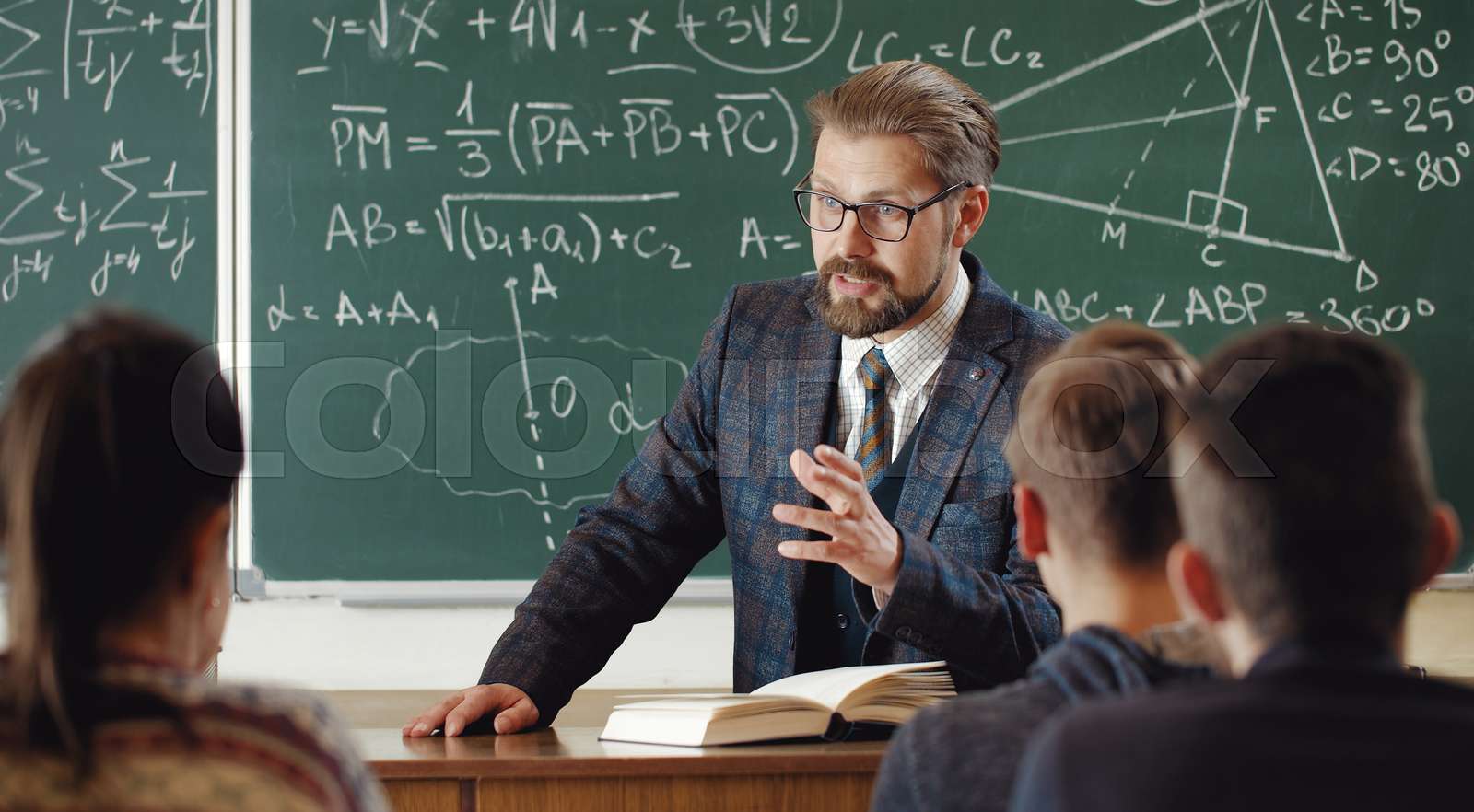 Professor explains subject to students | Stock image | Colourbox