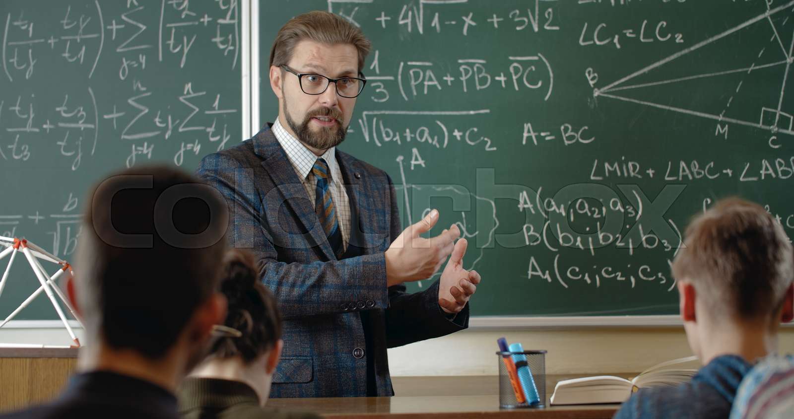 Professor explaining subject to students | Stock image | Colourbox