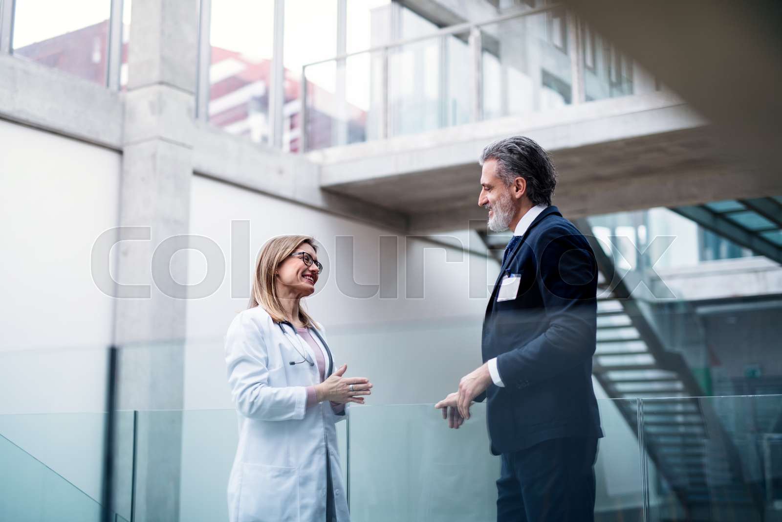 Doctor talking to a pharmaceutical sales representative. | Stock image ...