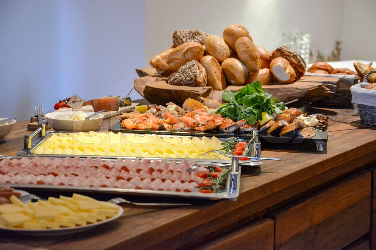 Breakfast buffet with rolls, cheese and several vegetables | Stock ...