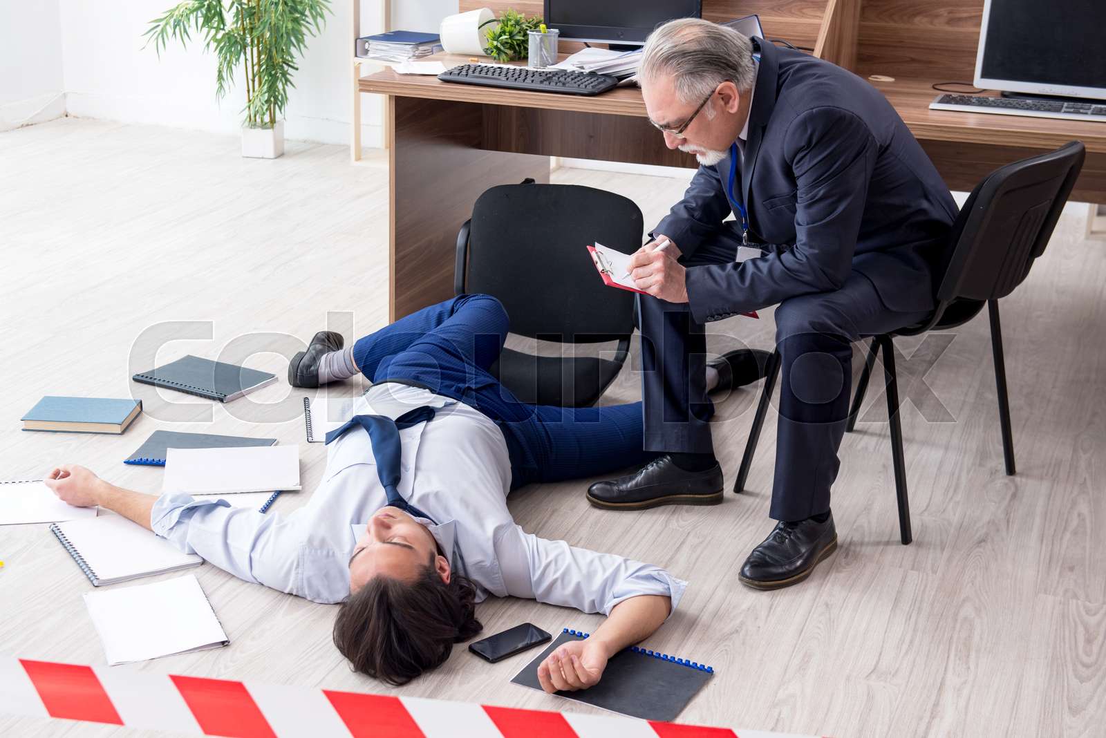 Forensic investigator and dead employee in the office | Stock image ...