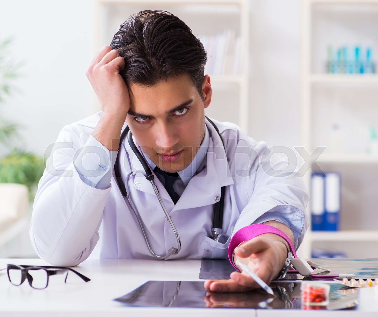 Doctor drug addict in the hospital | Stock image | Colourbox