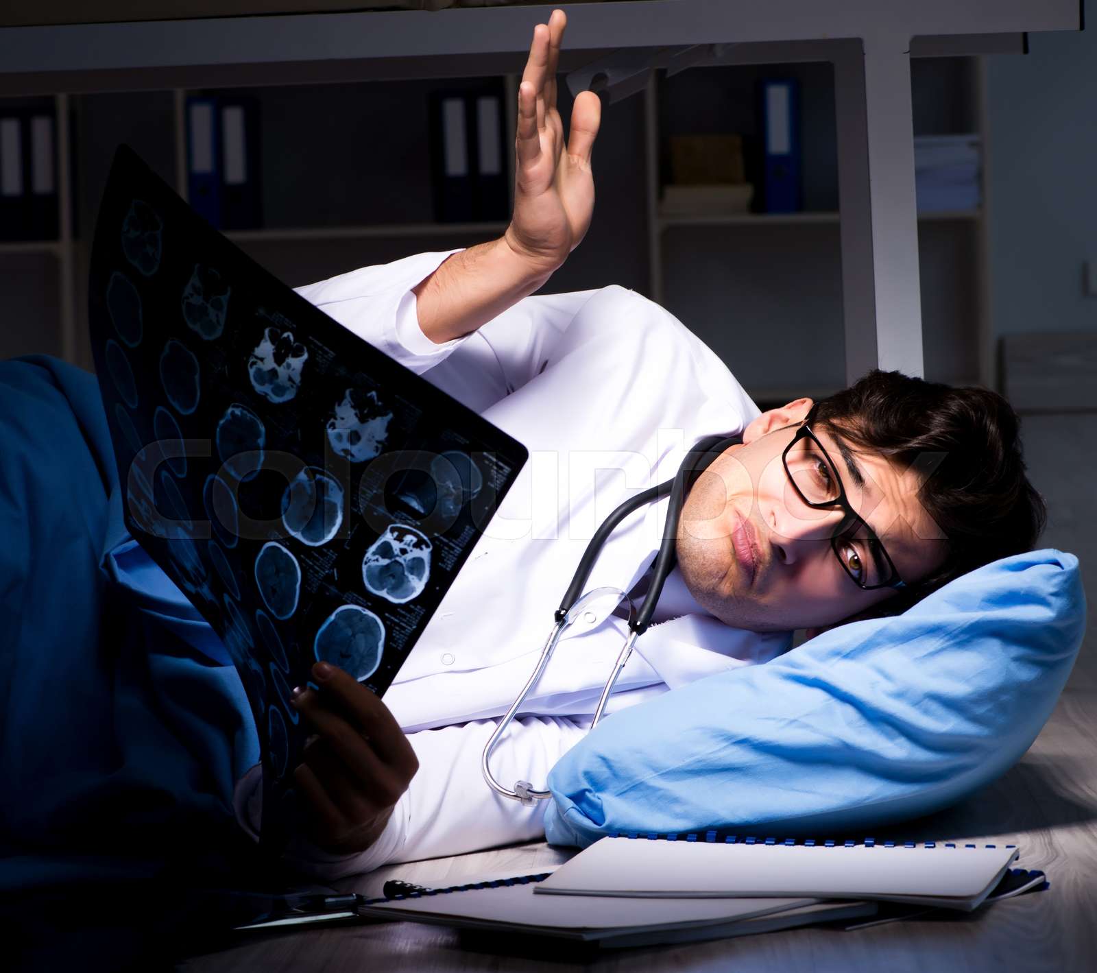 Doctor working night shift in hospital after long hours | Stock image ...
