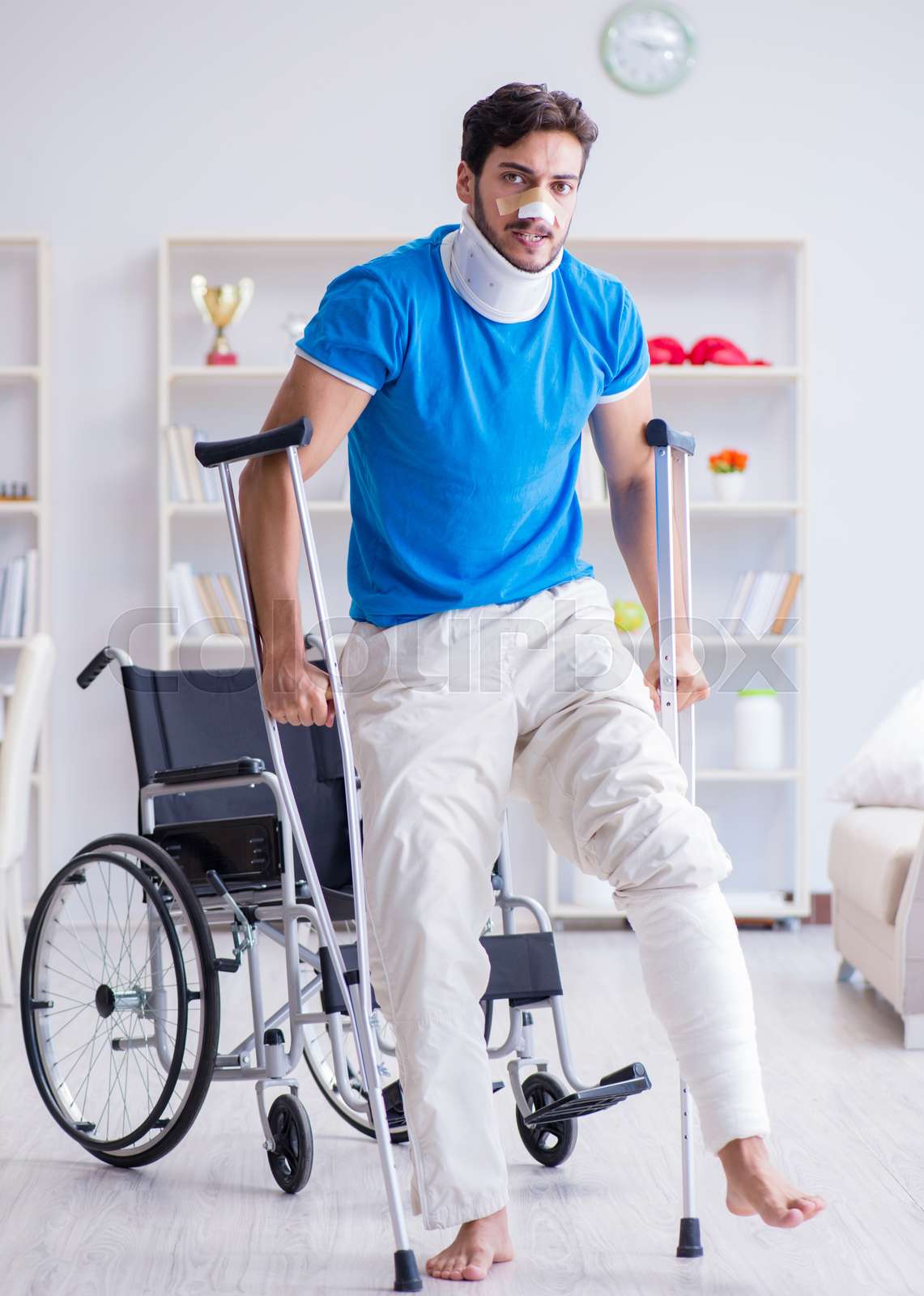 Injured young man recovering at home | Stock image | Colourbox