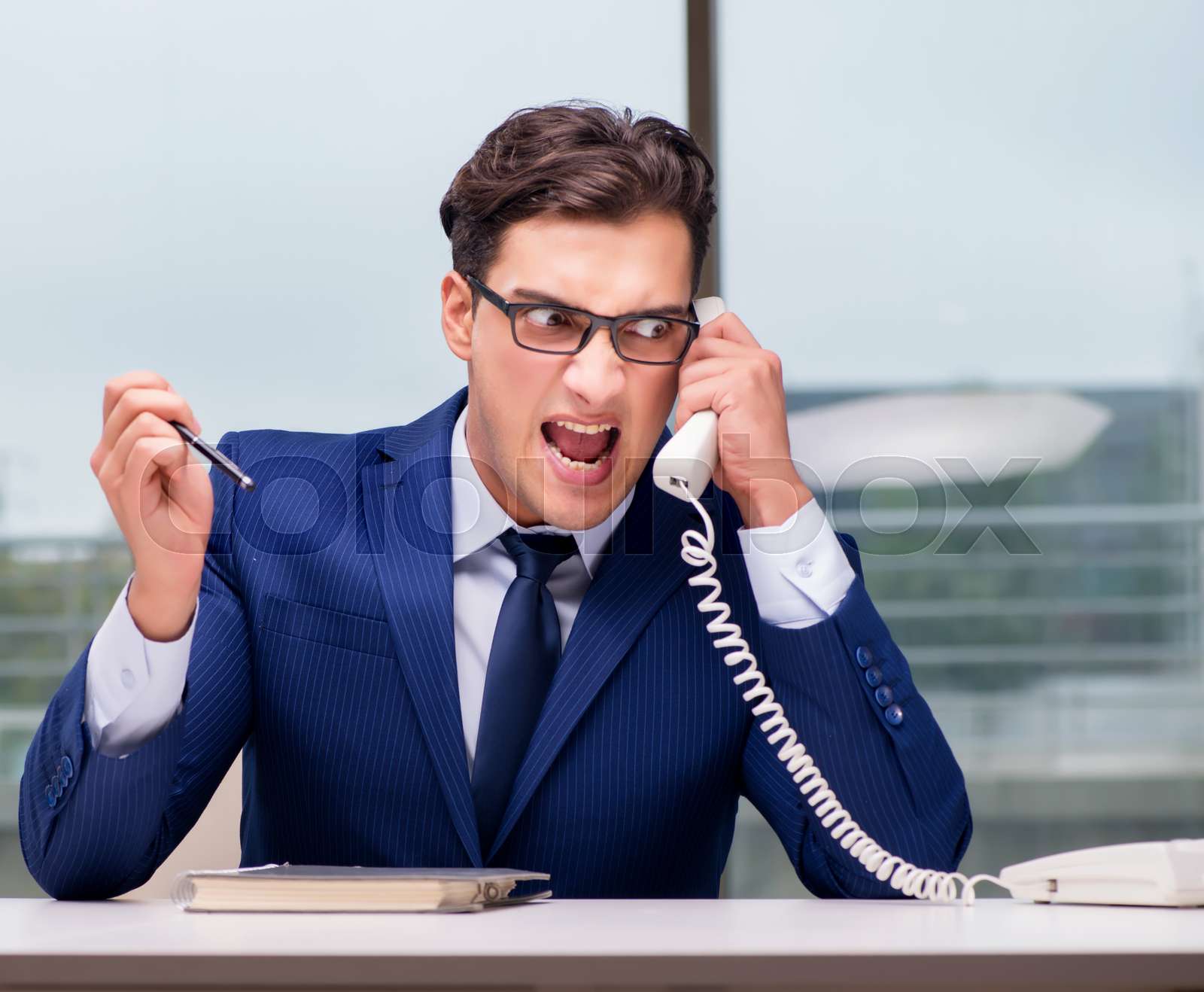 Angry call center employee yelling at customer | Stock image | Colourbox