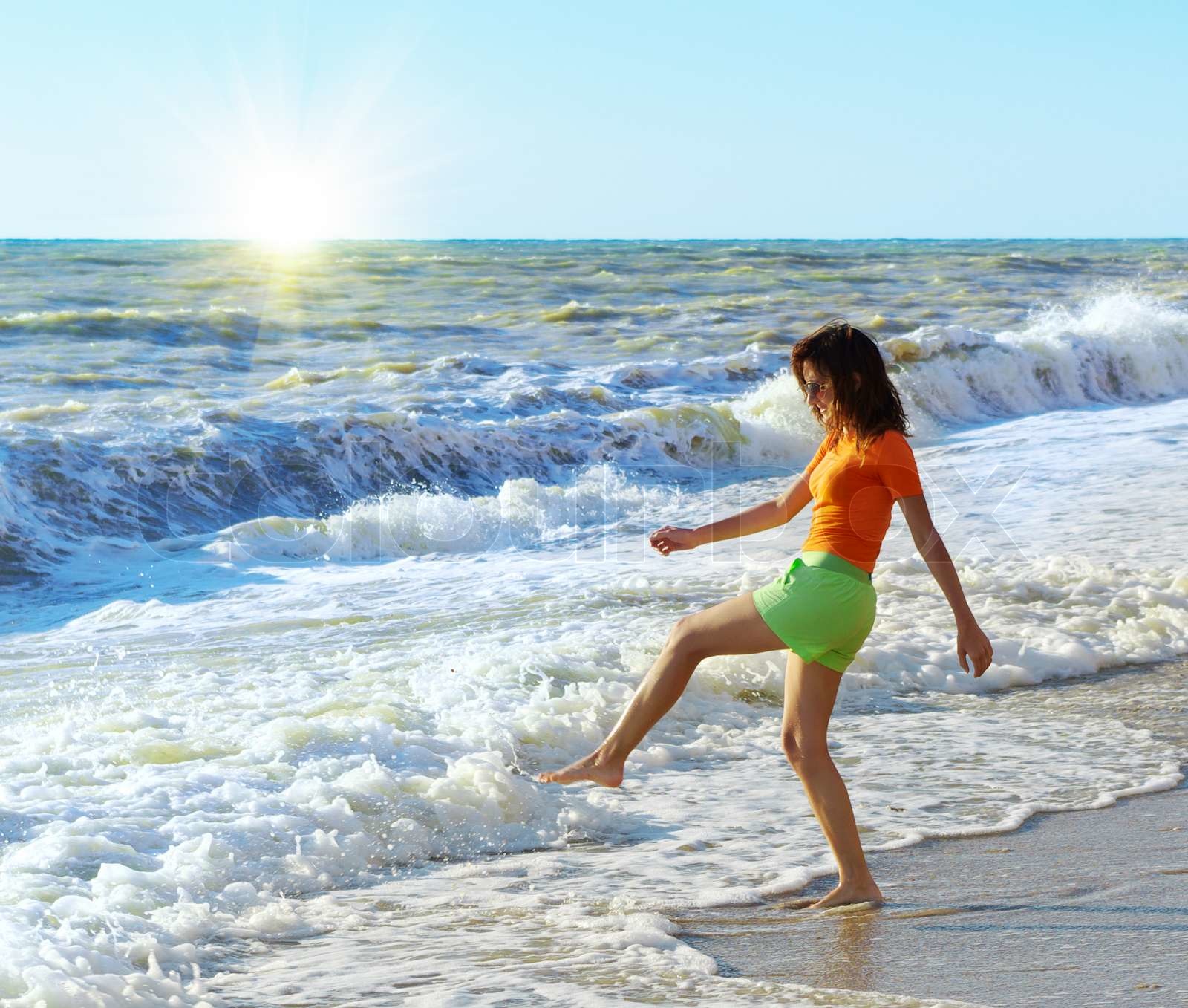 Girl play on the beach | Stock image | Colourbox