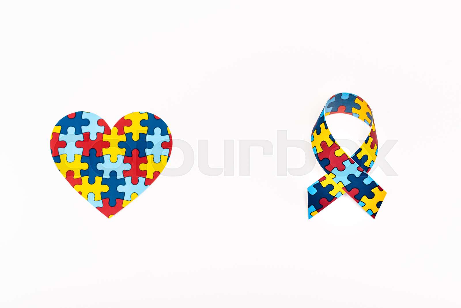 Top view of puzzle heart and awareness ribbon isolated on white, autism ...