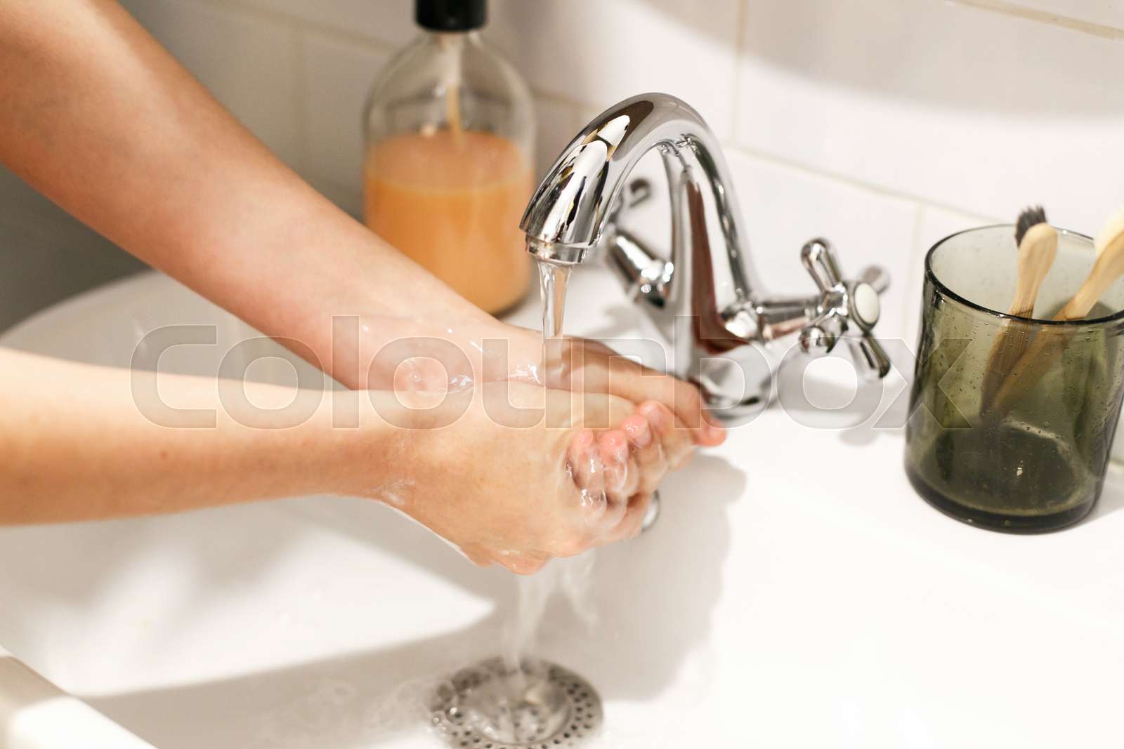 Washing hands under flowing water. Hands washing with proper technique ...