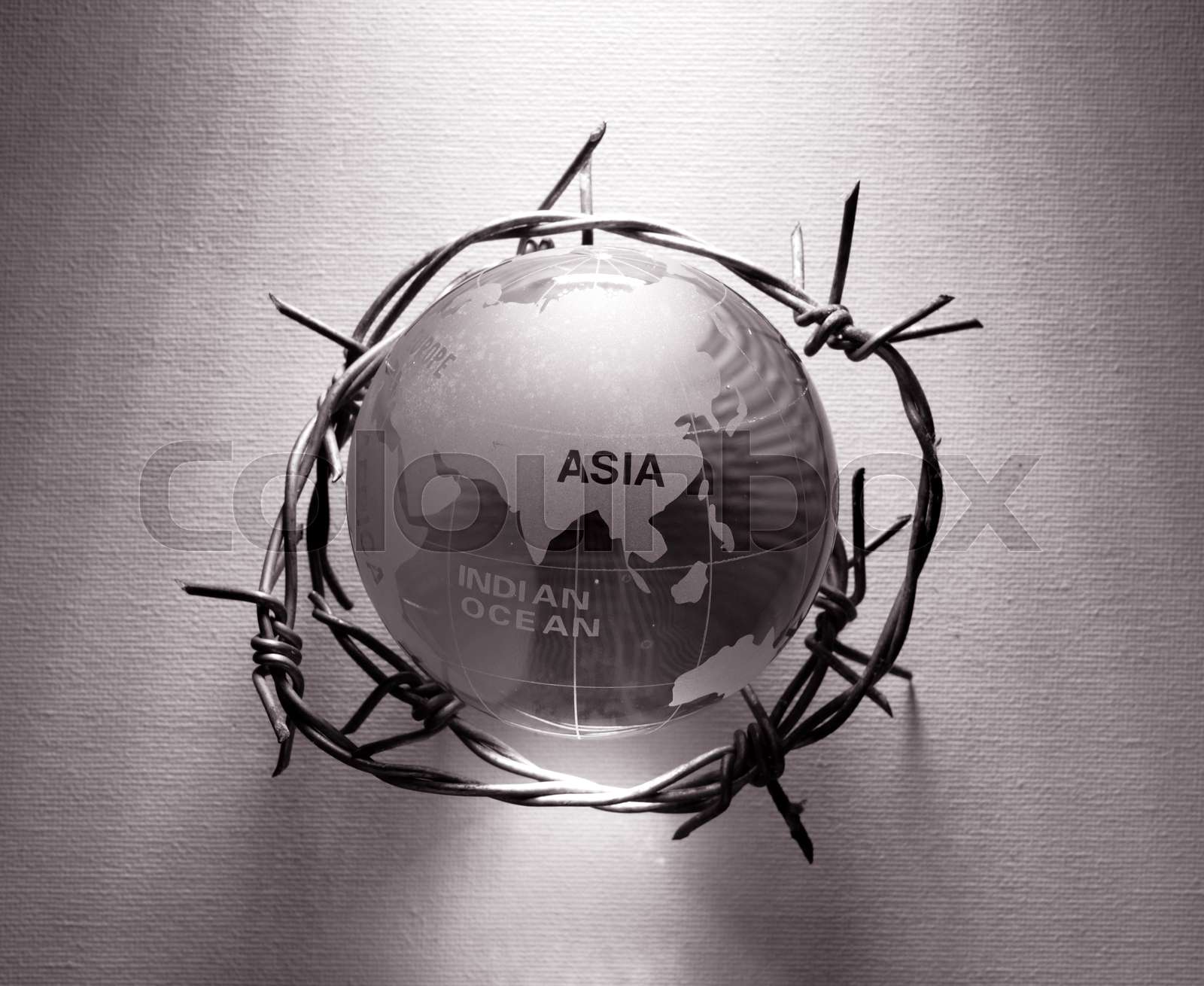 Globe wrapped in barb wire | Stock image | Colourbox