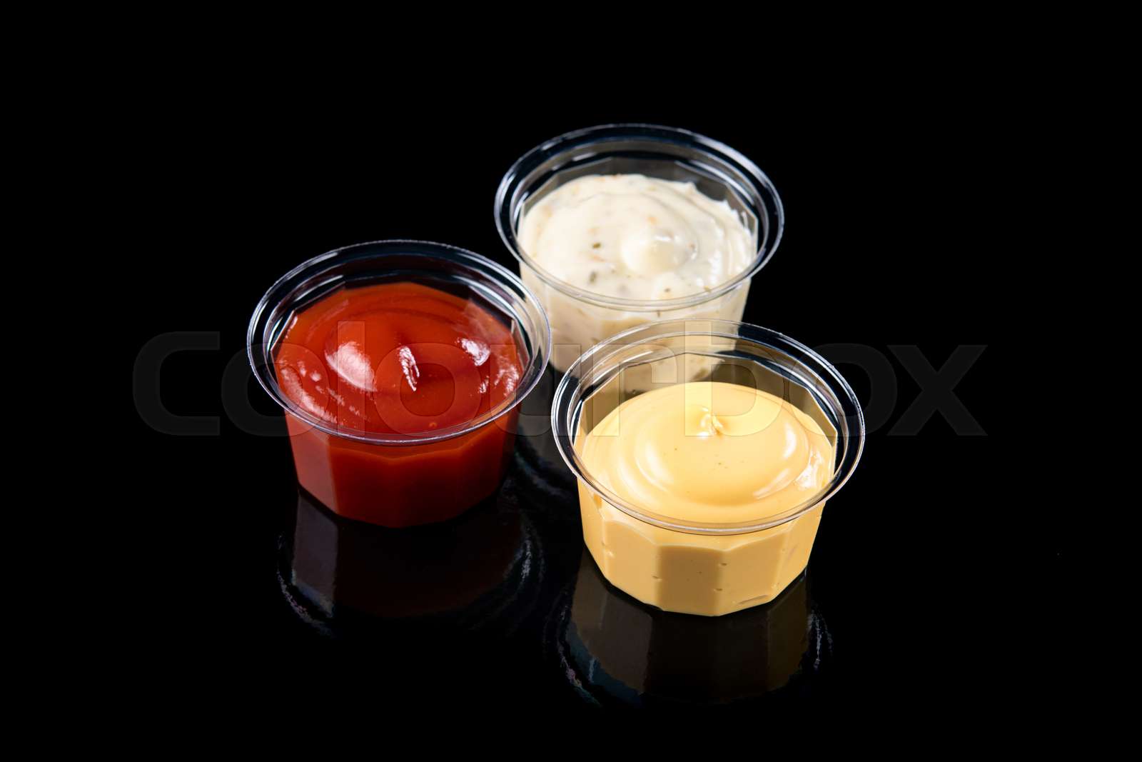 Containers with mayonnaise mustard and ketchup | Stock image | Colourbox