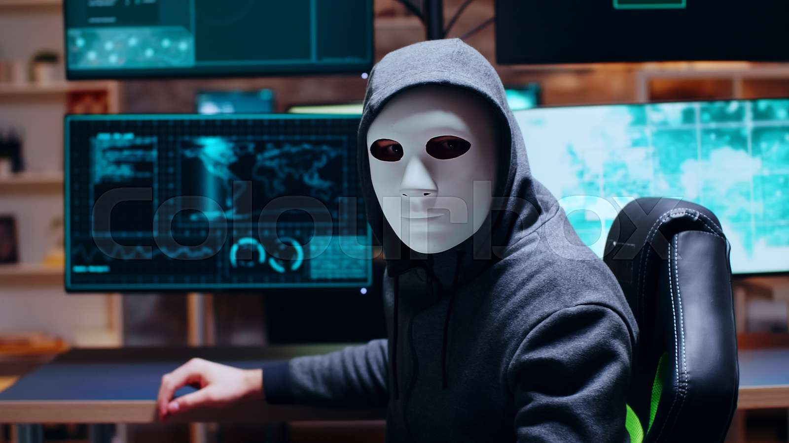 Wanted cyber criminal wearing a white mask | Stock image | Colourbox