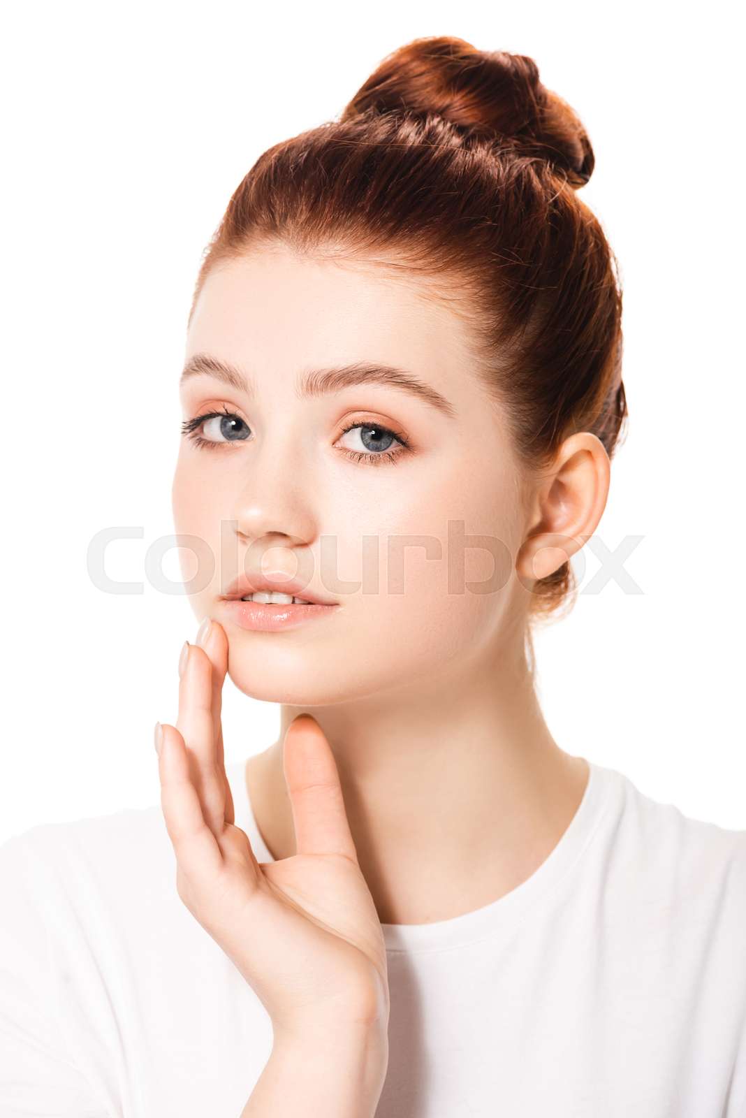 female teenager touching face with clean skin, isolated on white ...