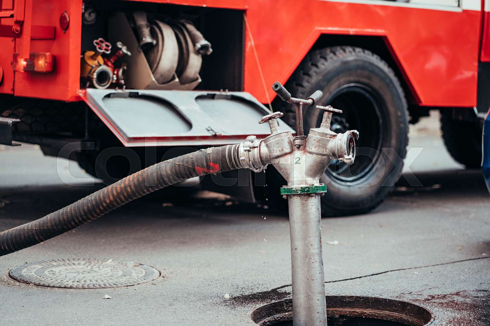 Fire Hydrant In Use During a Structure Fire | Stock image | Colourbox
