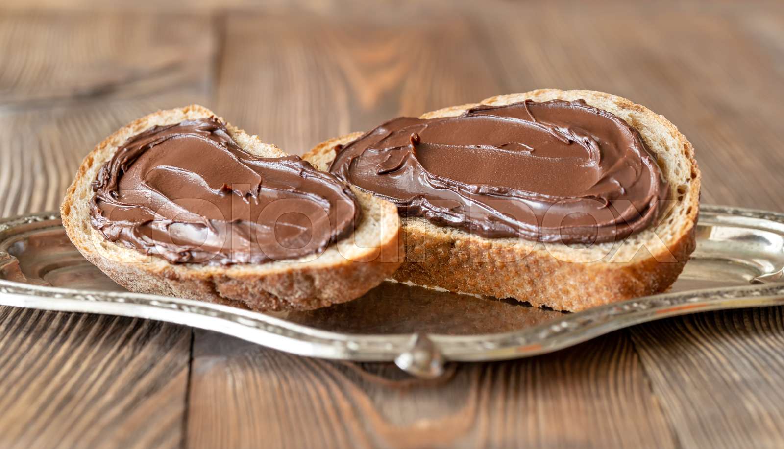 Slices of bread with chocolate paste | Stock image | Colourbox