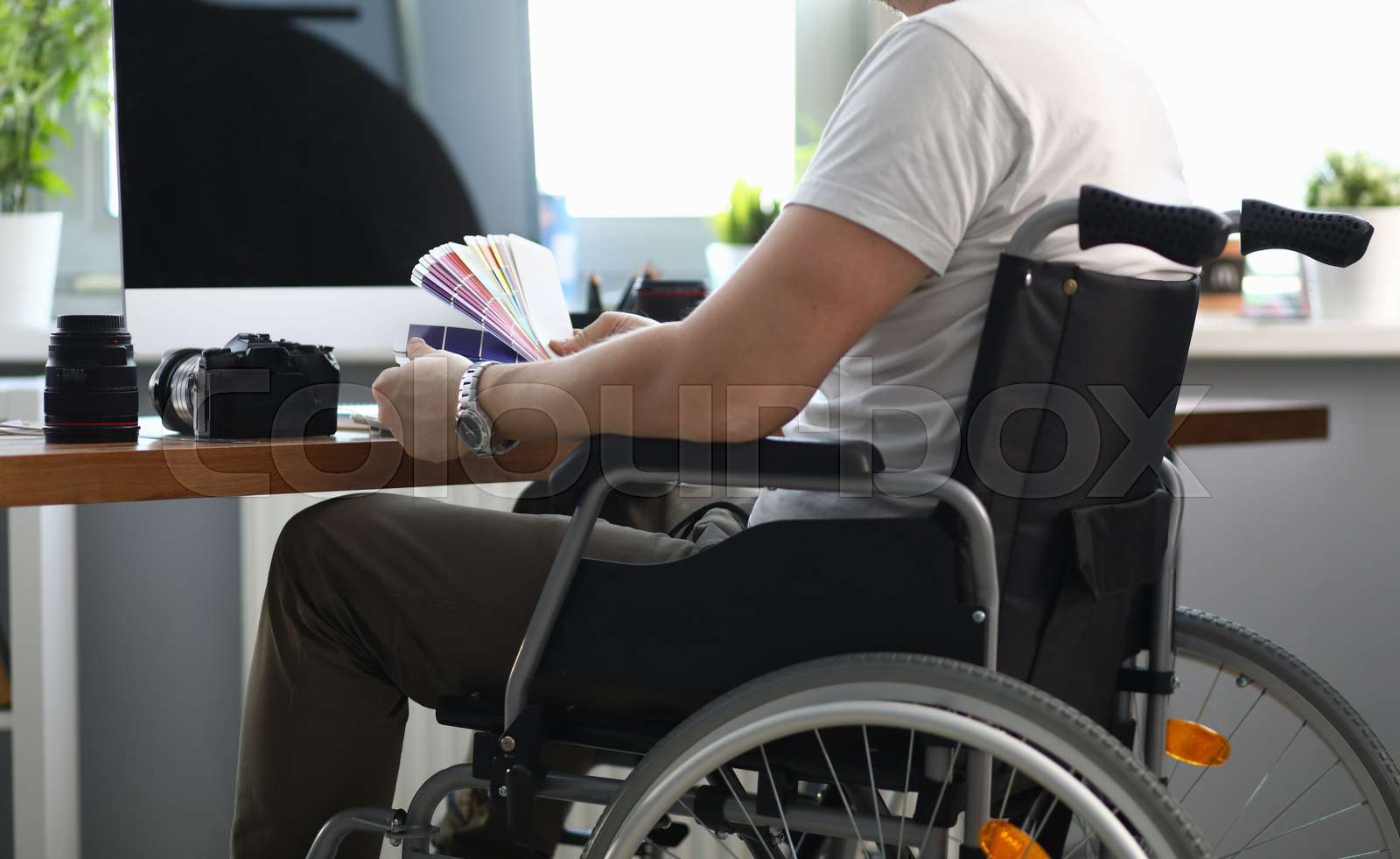 Talented man in adapted workplace | Stock image | Colourbox