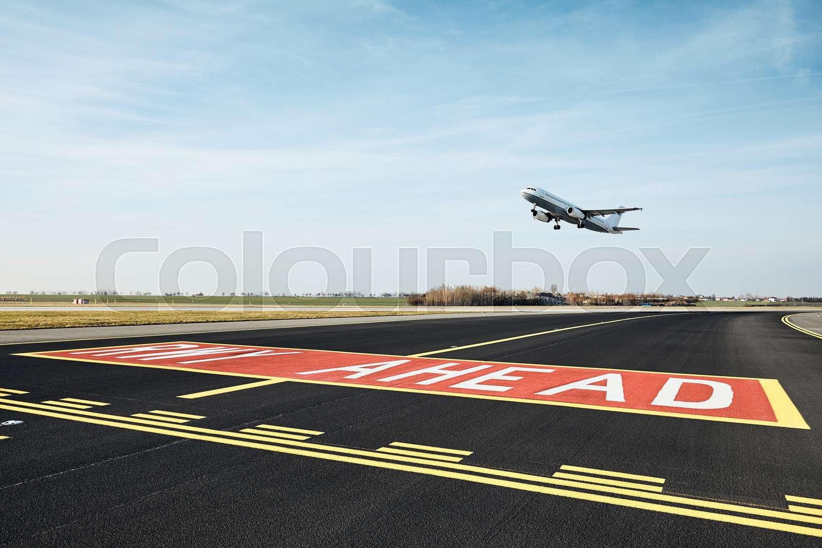 Airplane taking off from runway | Stock image | Colourbox