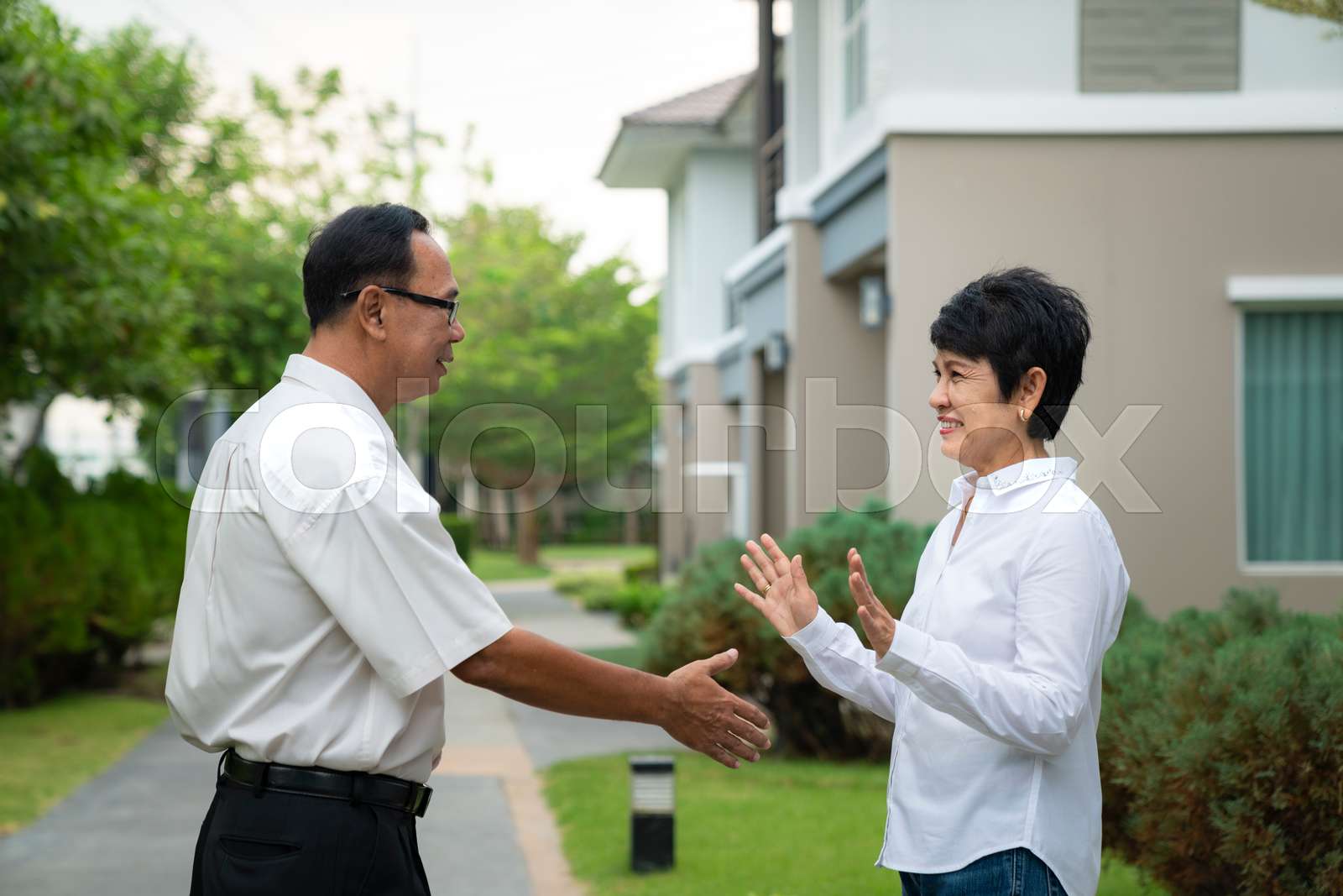 Old asian people no greeting by shakehands togather and use a mask for ...