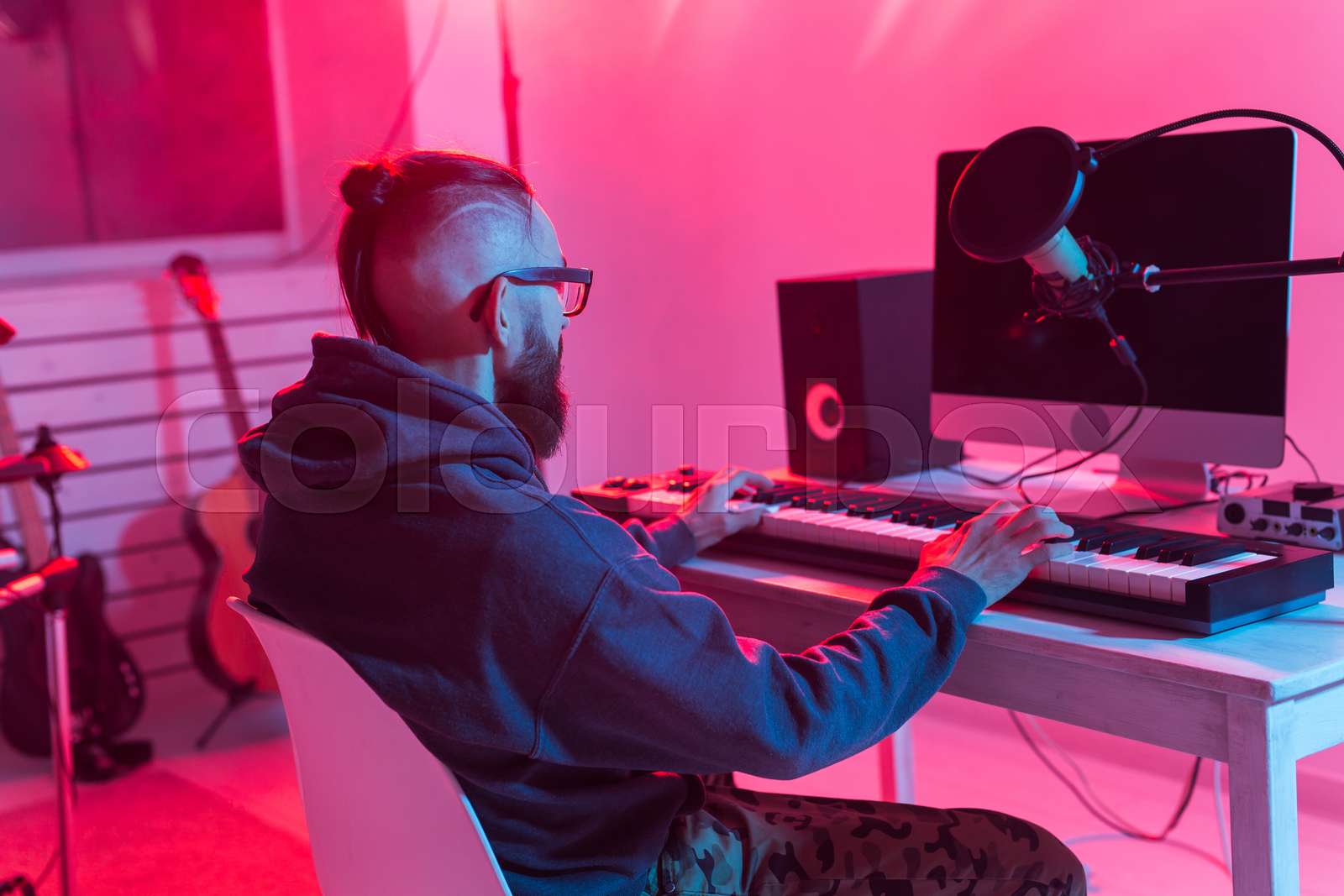 Male sound producer working in recording studio. | Stock image | Colourbox