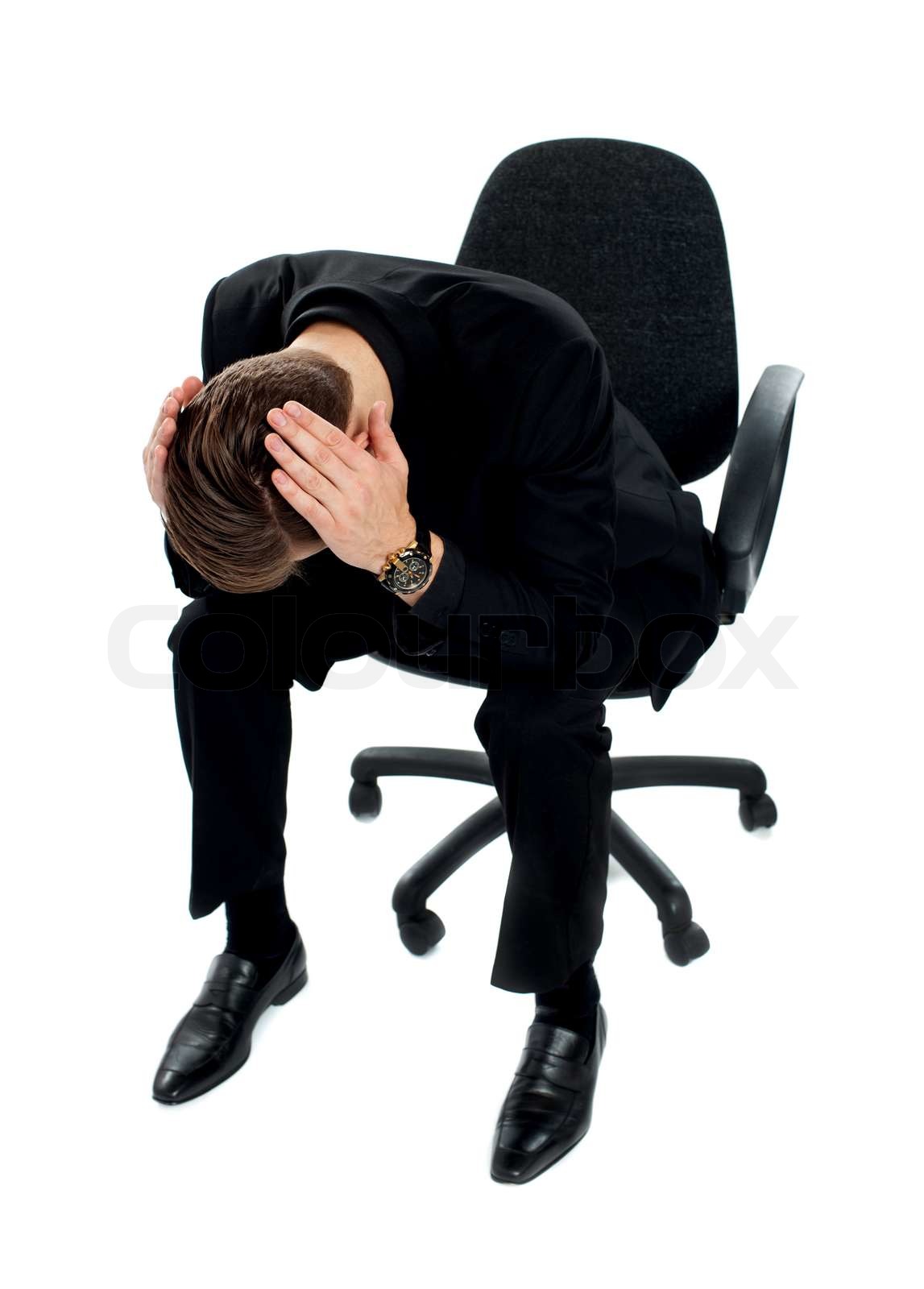Frustrated young man sitting on chair | Stock image | Colourbox