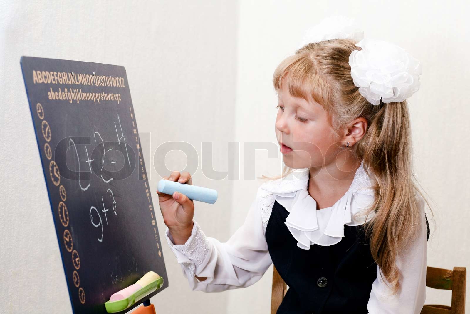 Writing girl | Stock image | Colourbox
