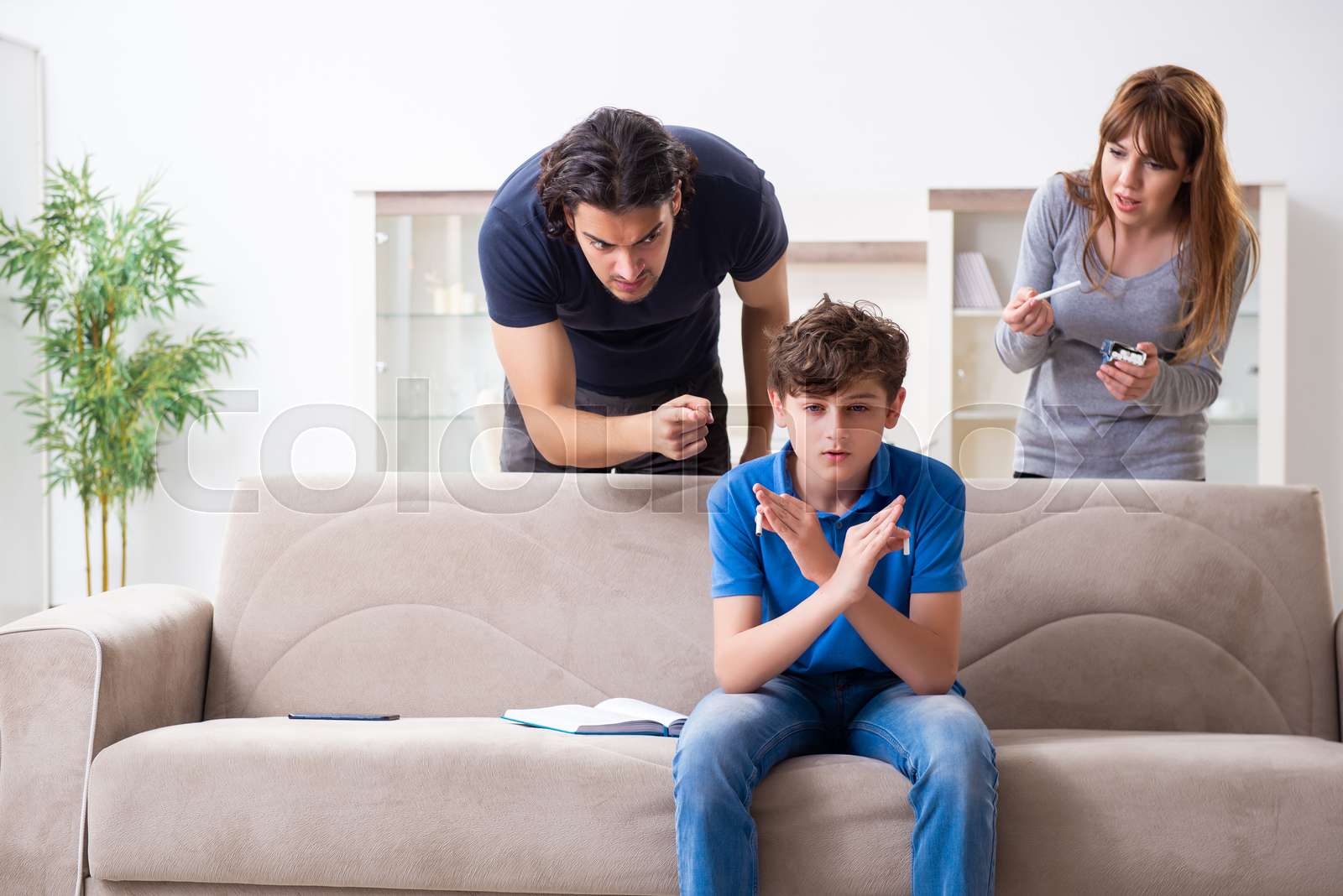 Concept of underage smoking with young boy and family | Stock image ...