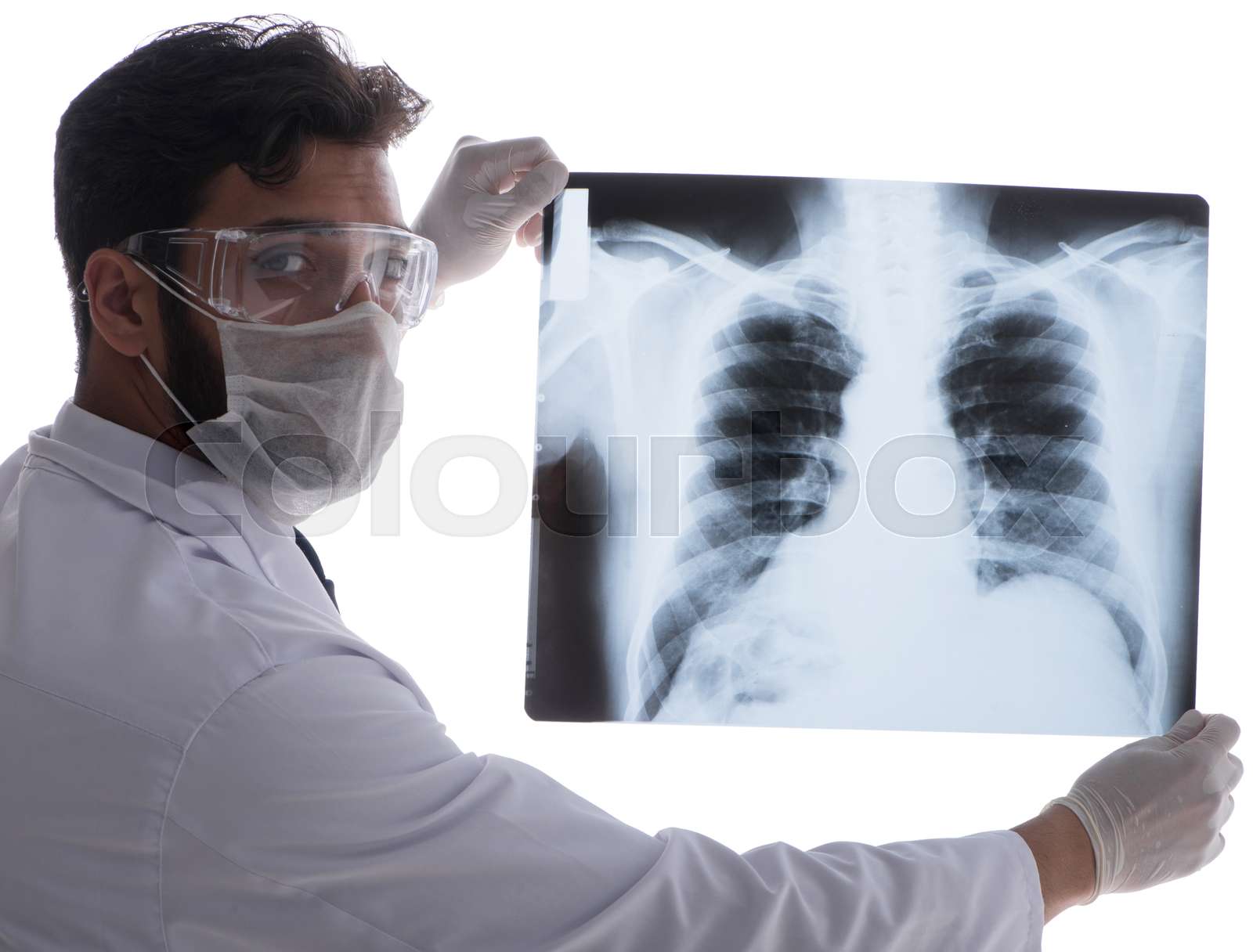 Young doctor looking at x-ray images isolated on white | Stock image ...