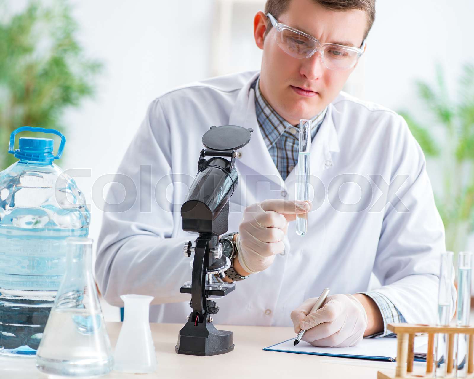 Young chemist student experimenting in lab | Stock image | Colourbox
