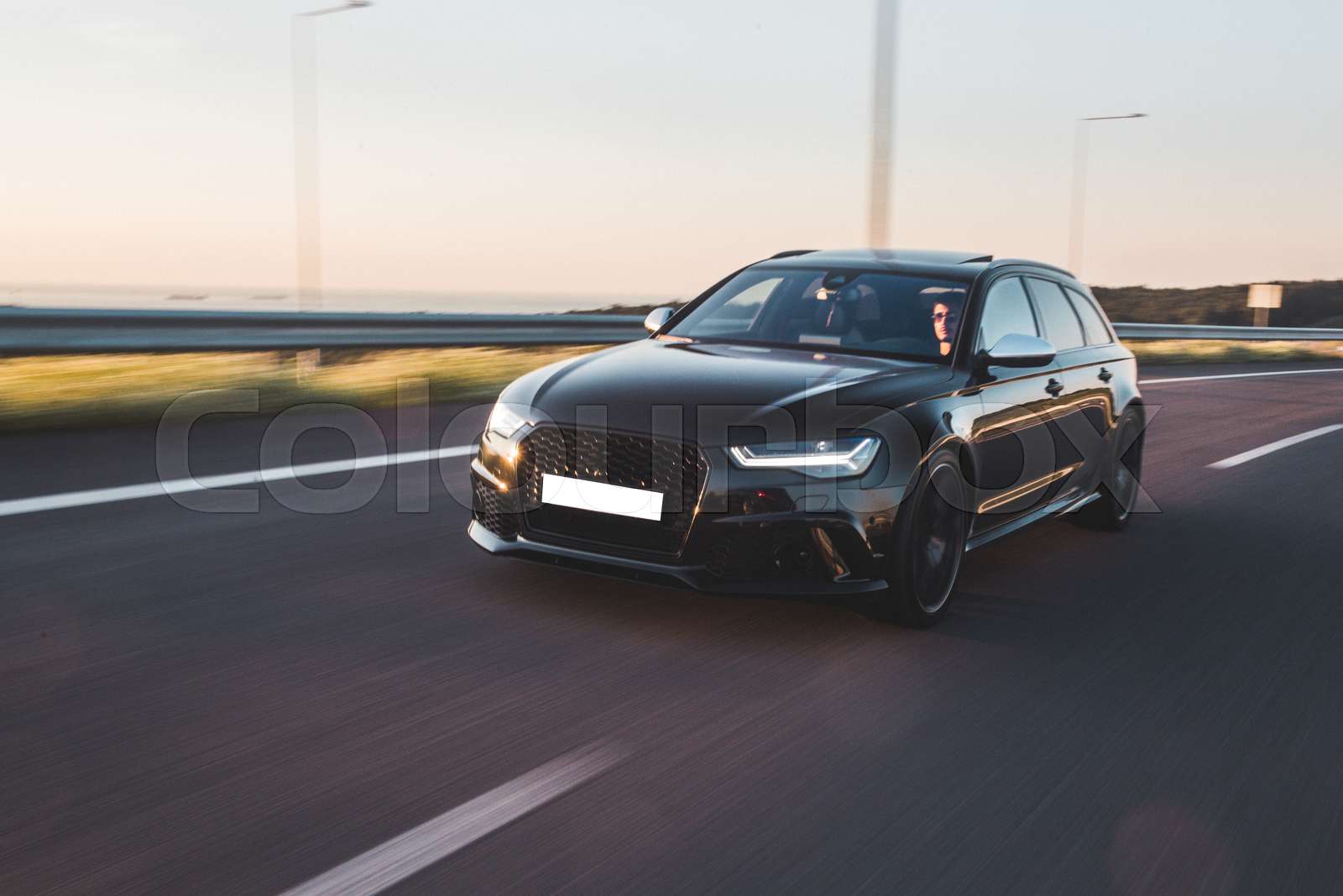 Black suv high speed drive on the road | Stock image | Colourbox