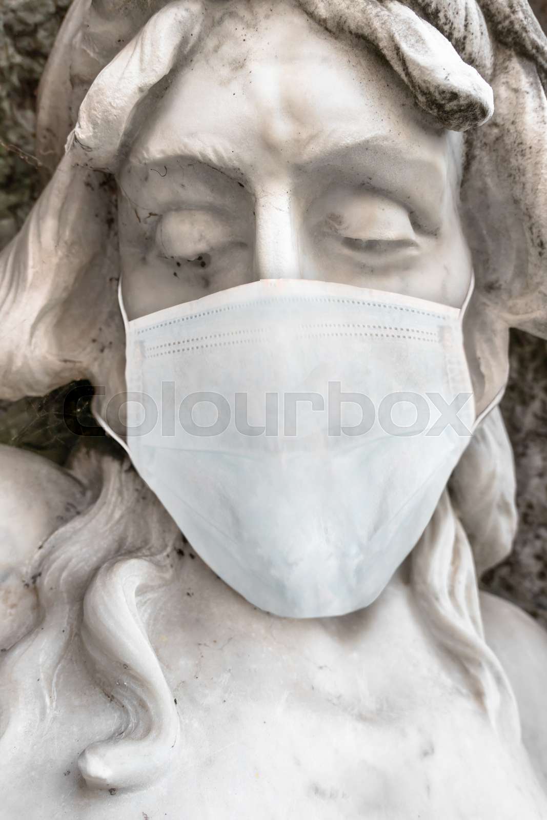 Statue of Jesus with medical mask | Stock image | Colourbox