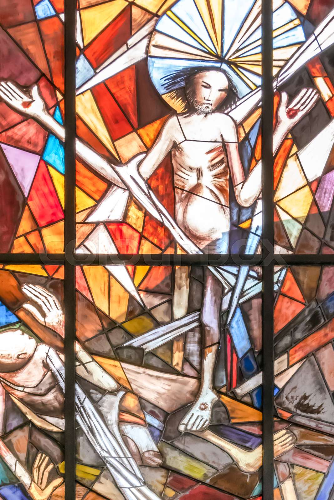 Stained glass window of Jesus Christ crucified | Stock image | Colourbox