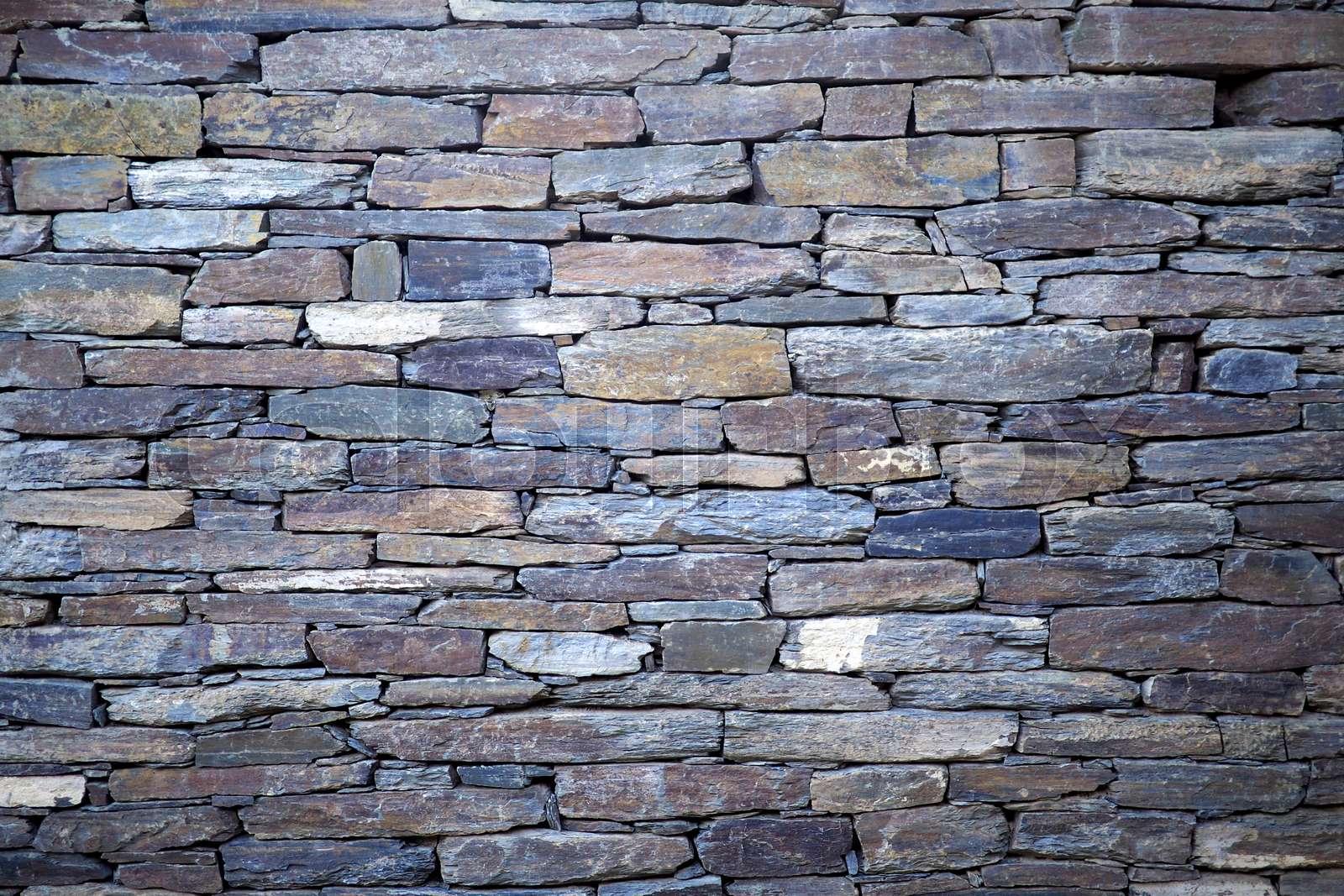 Abstract rock wall detail, stonework | Stock image | Colourbox