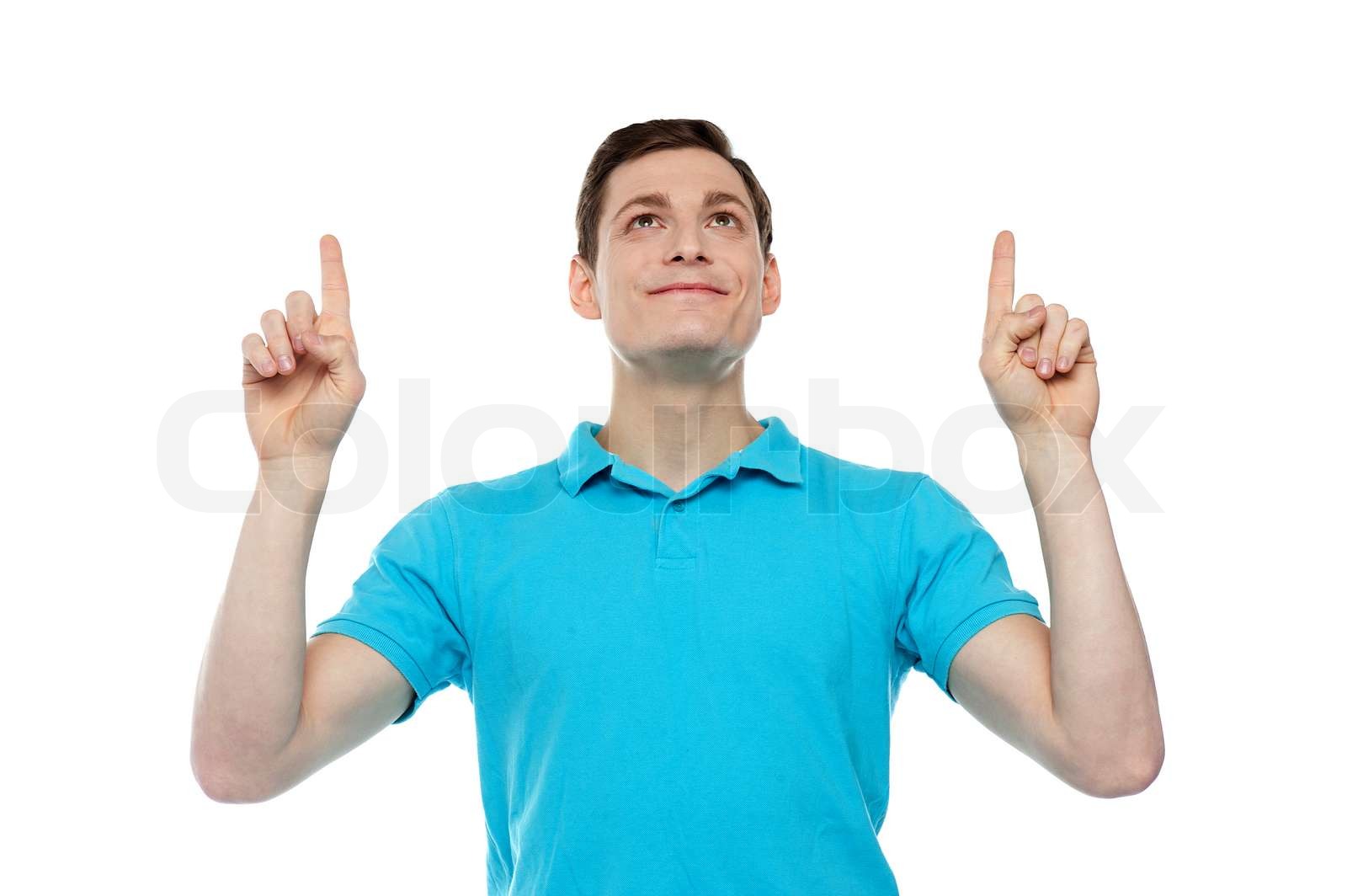 Caucasian man point and looking upwards | Stock image | Colourbox