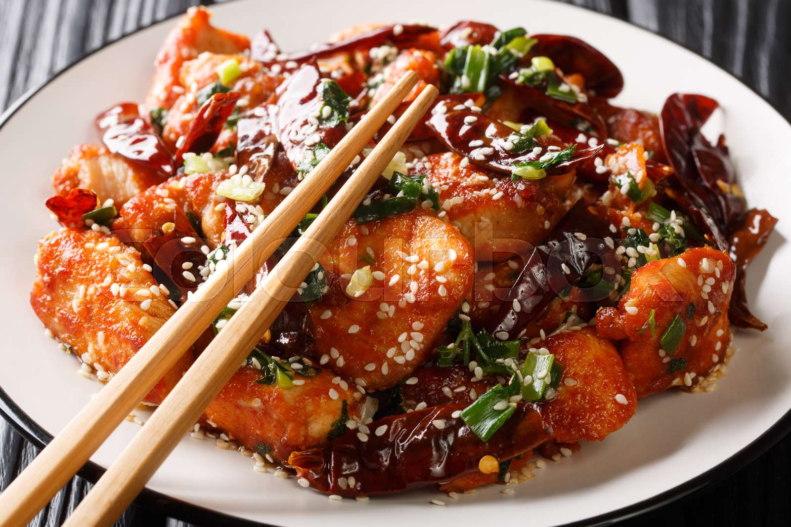 Very spicy Sichuan mala chicken is a popular dish in China close-up in ...
