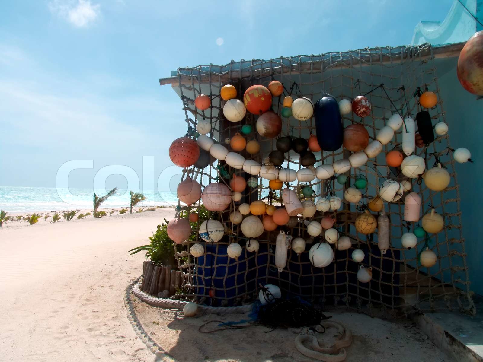 Colorful fishnet floats on the caribbean beach | Stock image | Colourbox
