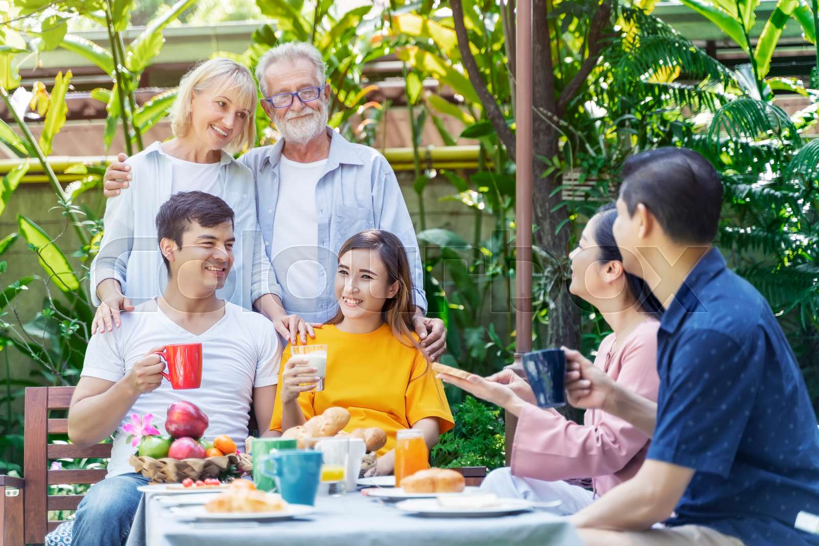 Happy family times. Peoples smiling when meeting in backyard party ...